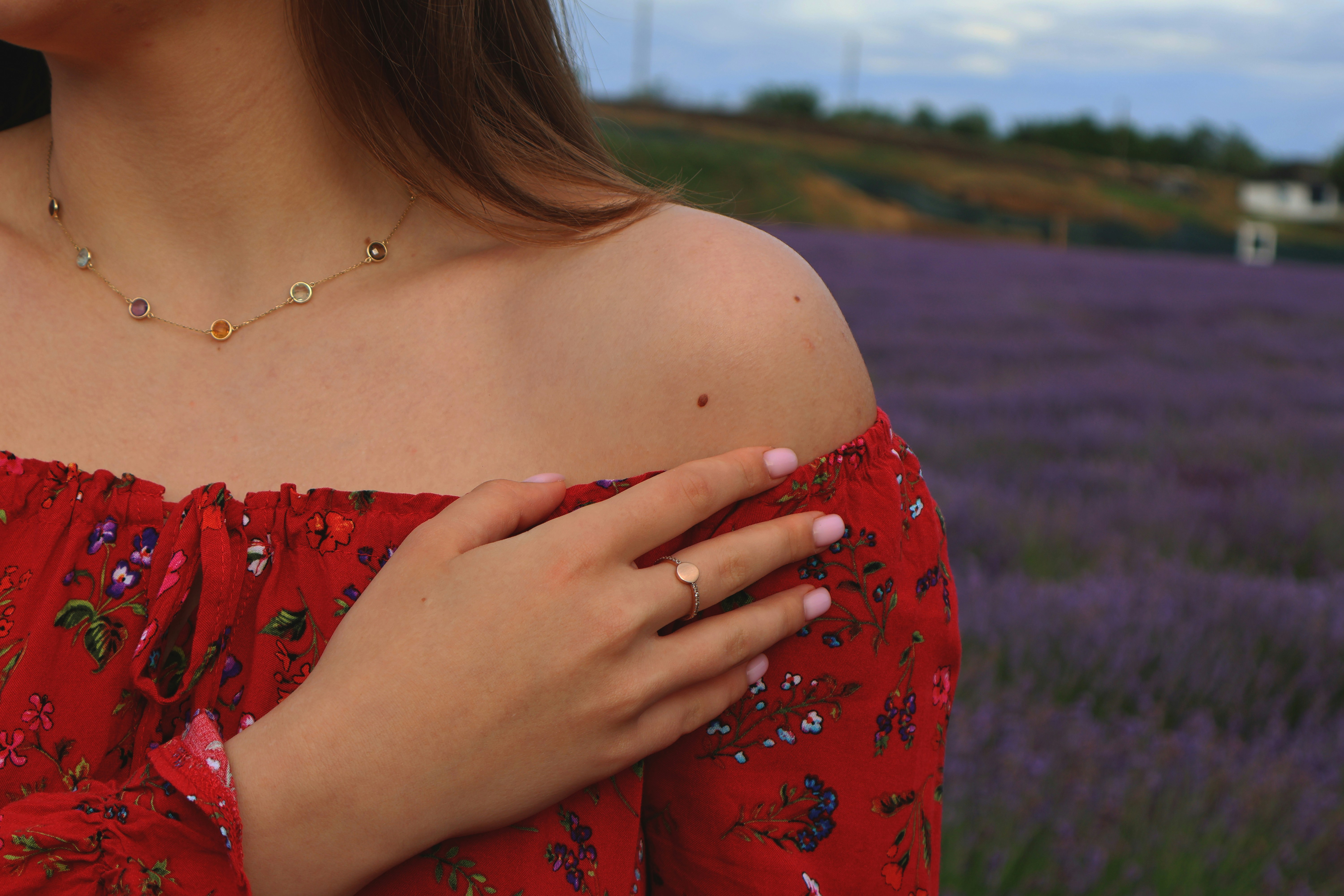 Red Off-Shoulder Portrait Framed by a Lavender Sea