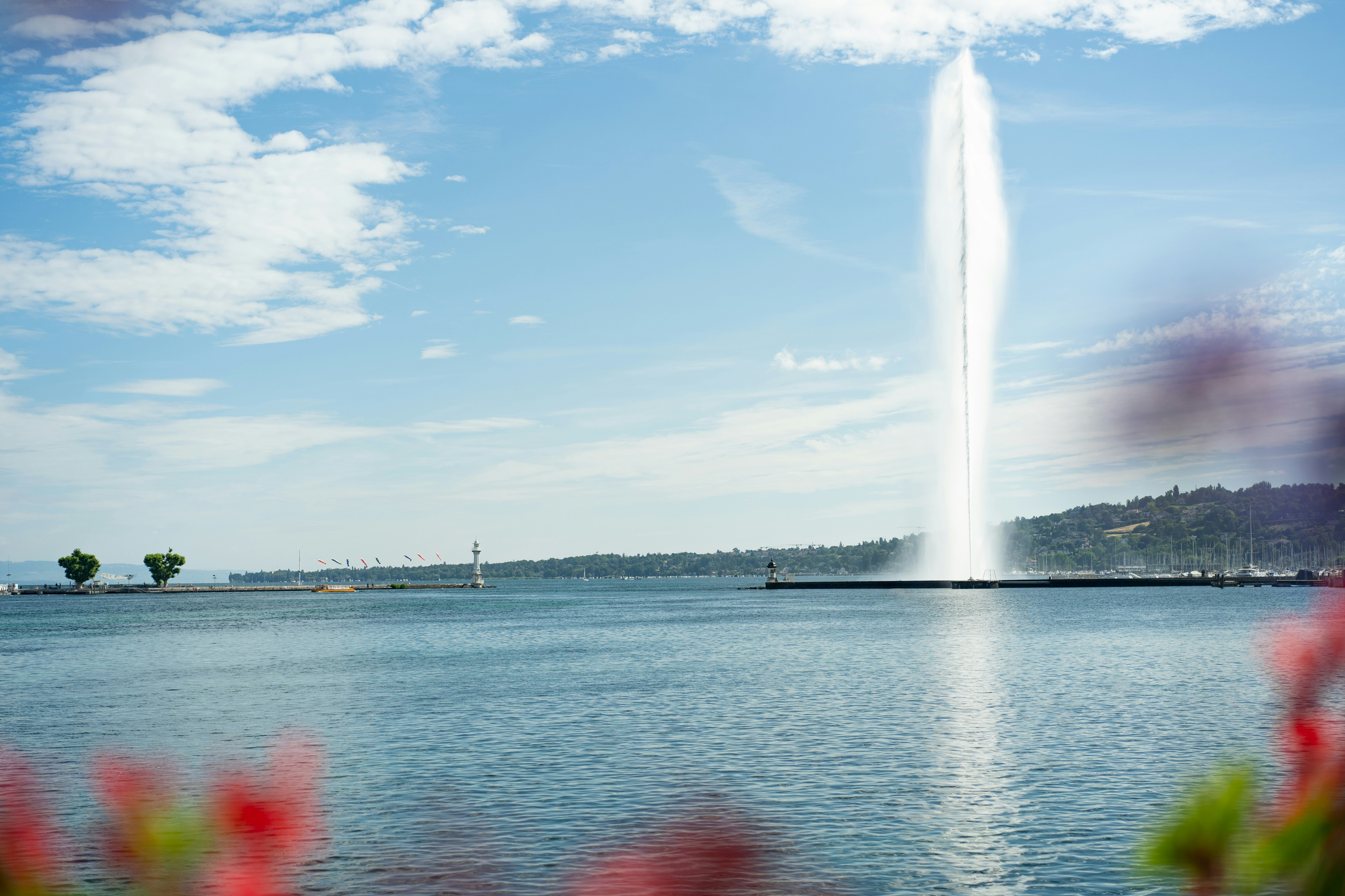 A large fountain spewing water into the air photo – Free Blue Image on ...