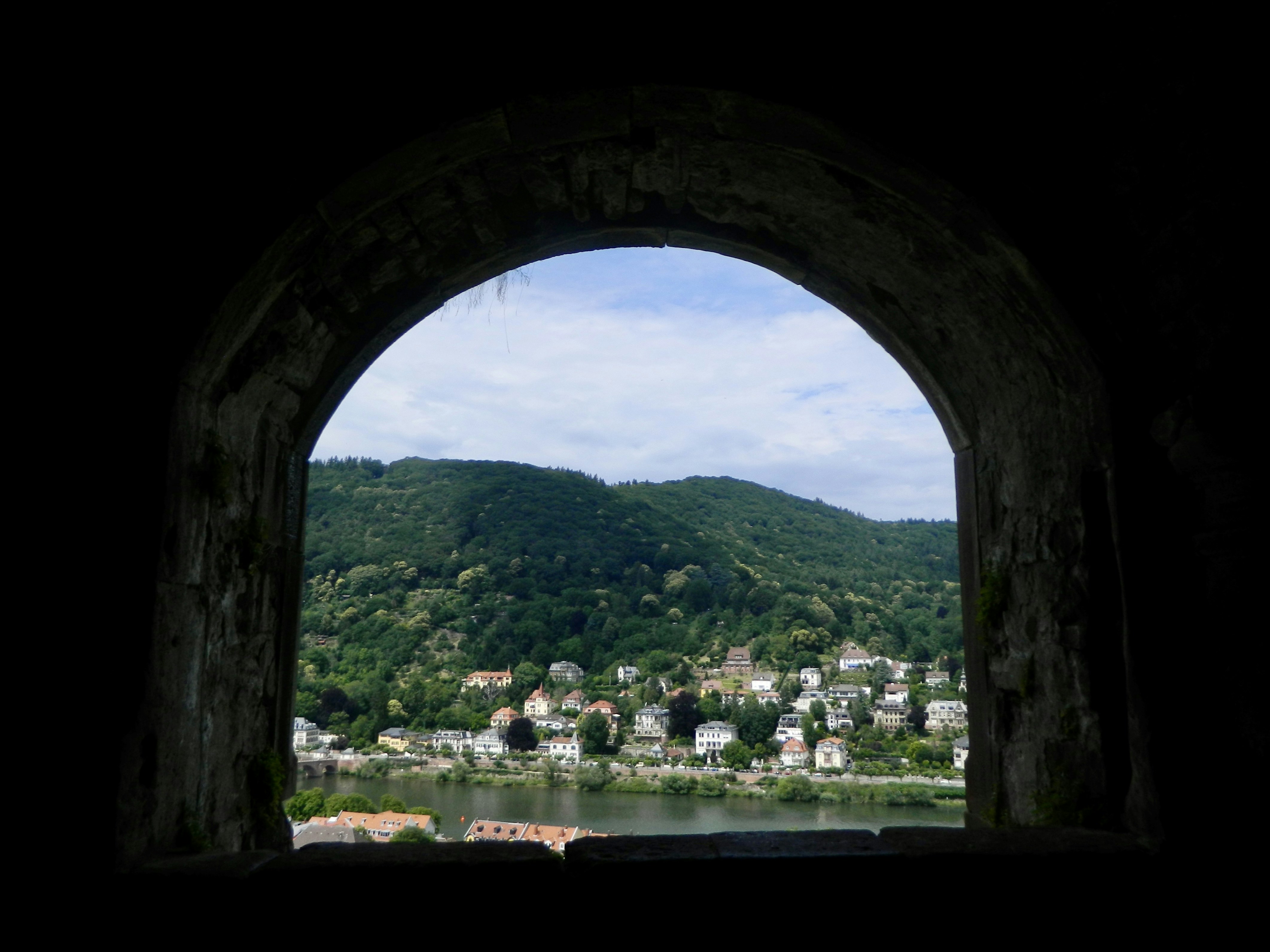 A view of a town through a window photo – Free Wallpaper Image on Unsplash