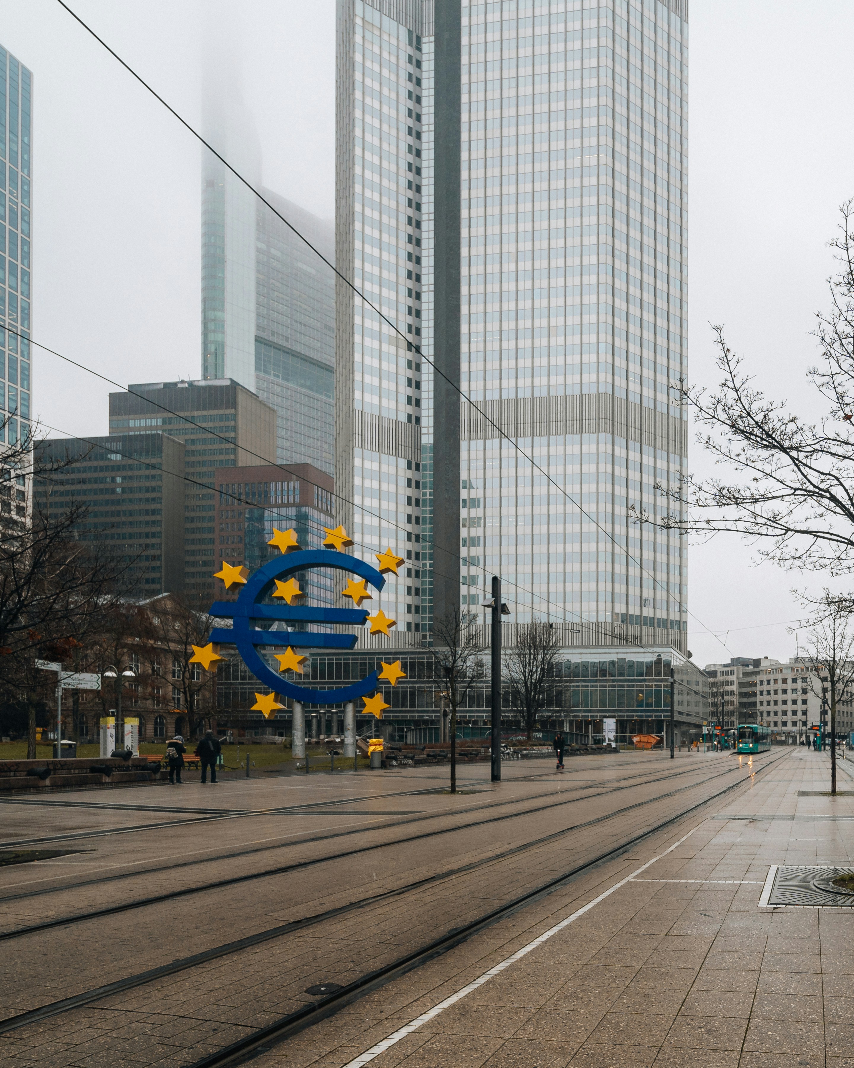 Circling Stars: The Euro Emblem Framed by Titanium Towers