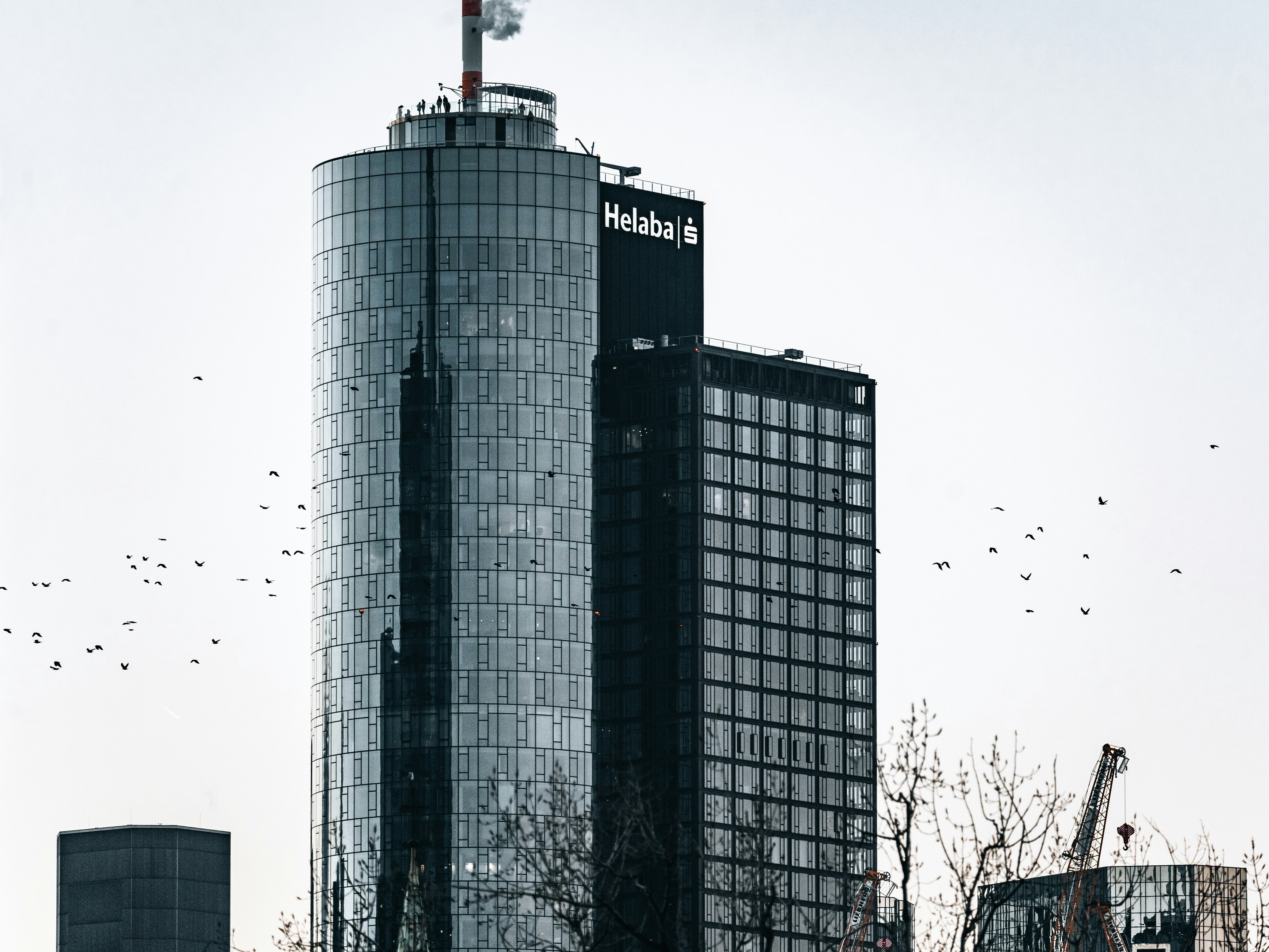 A tall building with a sky scraper on top of it photo – Free Building ...