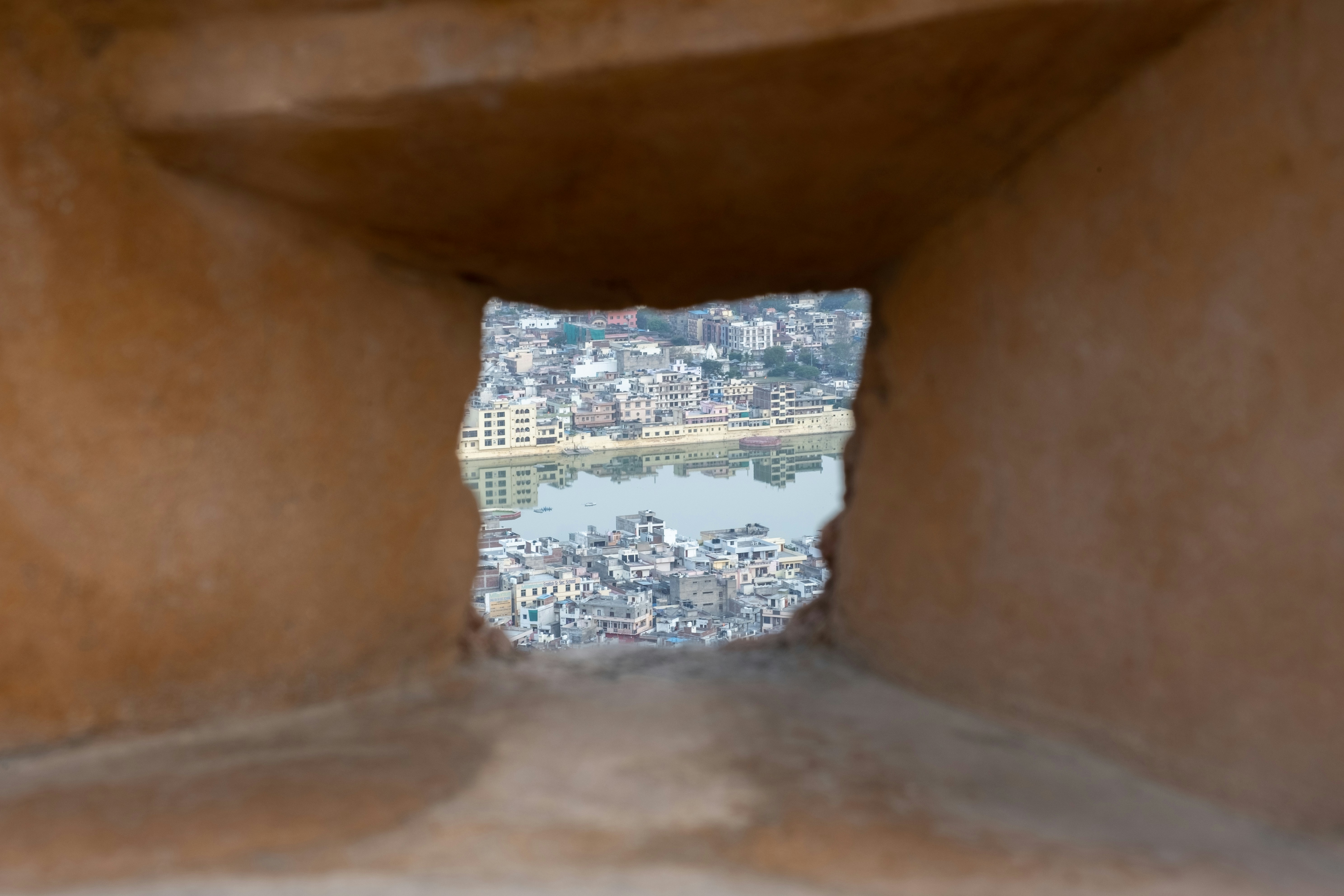 Stone Window to a Quiet Coastal City Across the Inlet