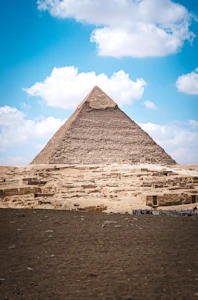 Cerulean Sky over the Great Pyramid: Sunlit Stones and Desert Quiet
