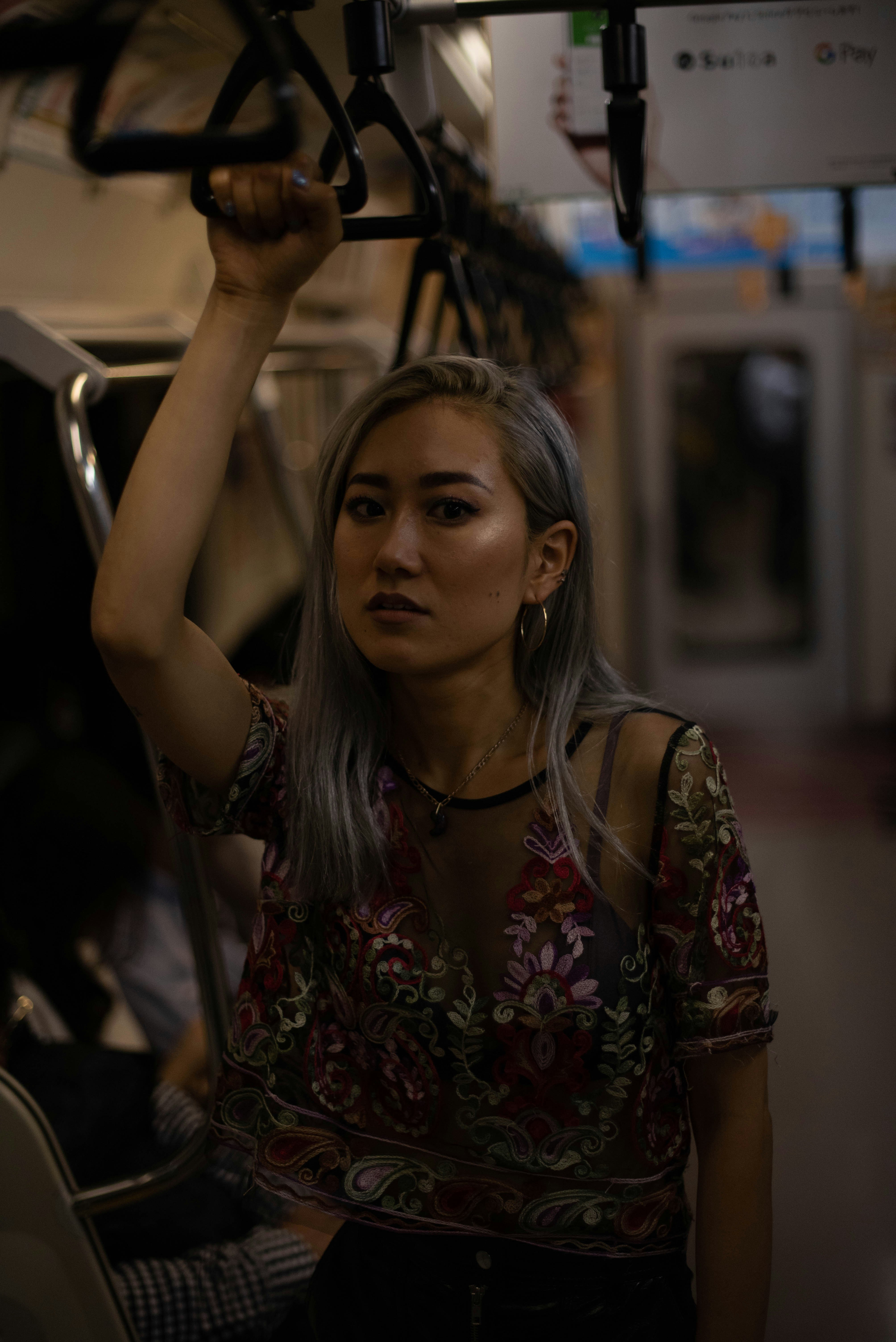 A woman is holding up a bike rack photo – Free Head Image on Unsplash