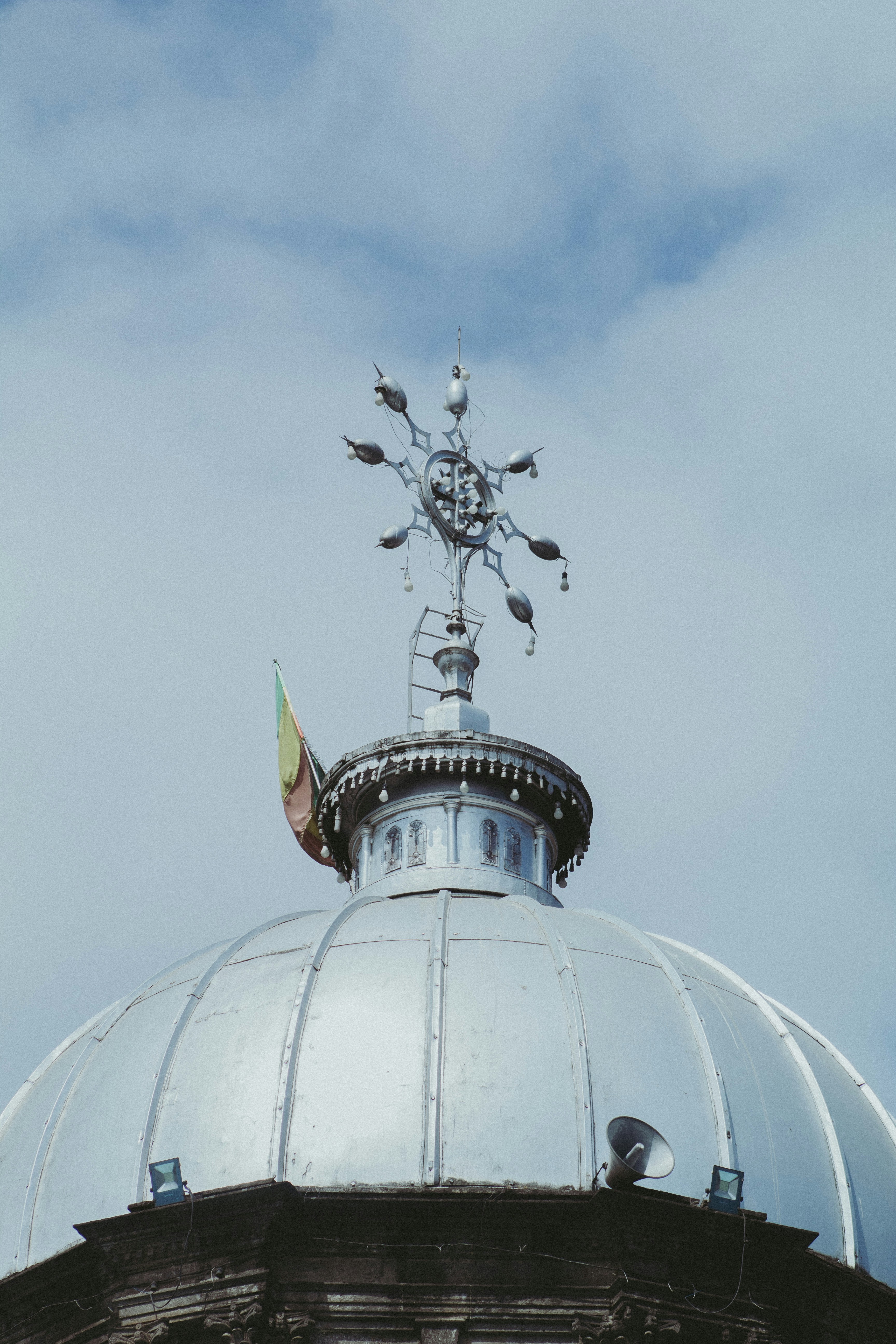 Weathervane Crown: A Silver Dome's Ornate Peak
