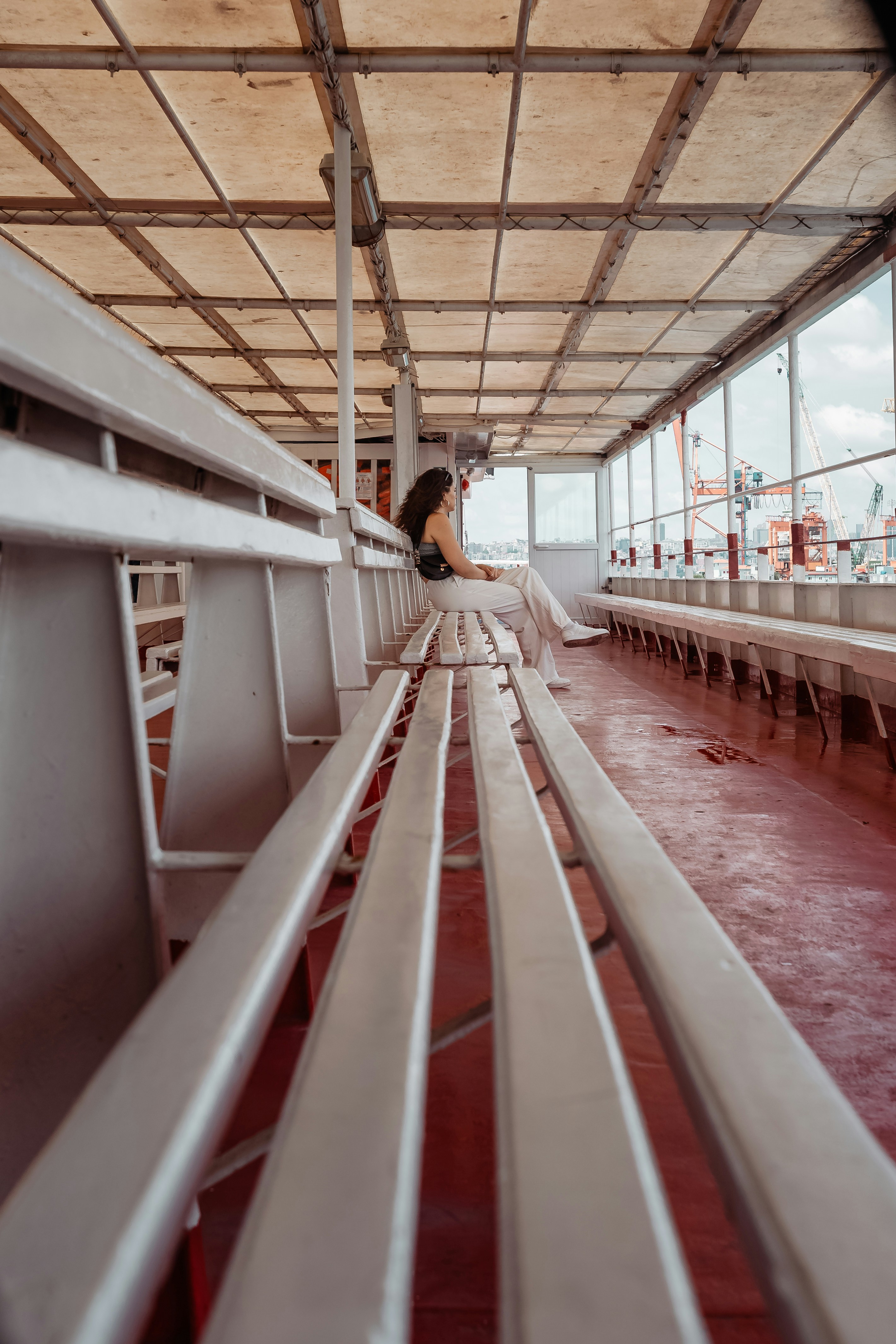 Midship Silence: A Solo Passenger Beneath the Canopy on a Harbor Ferry