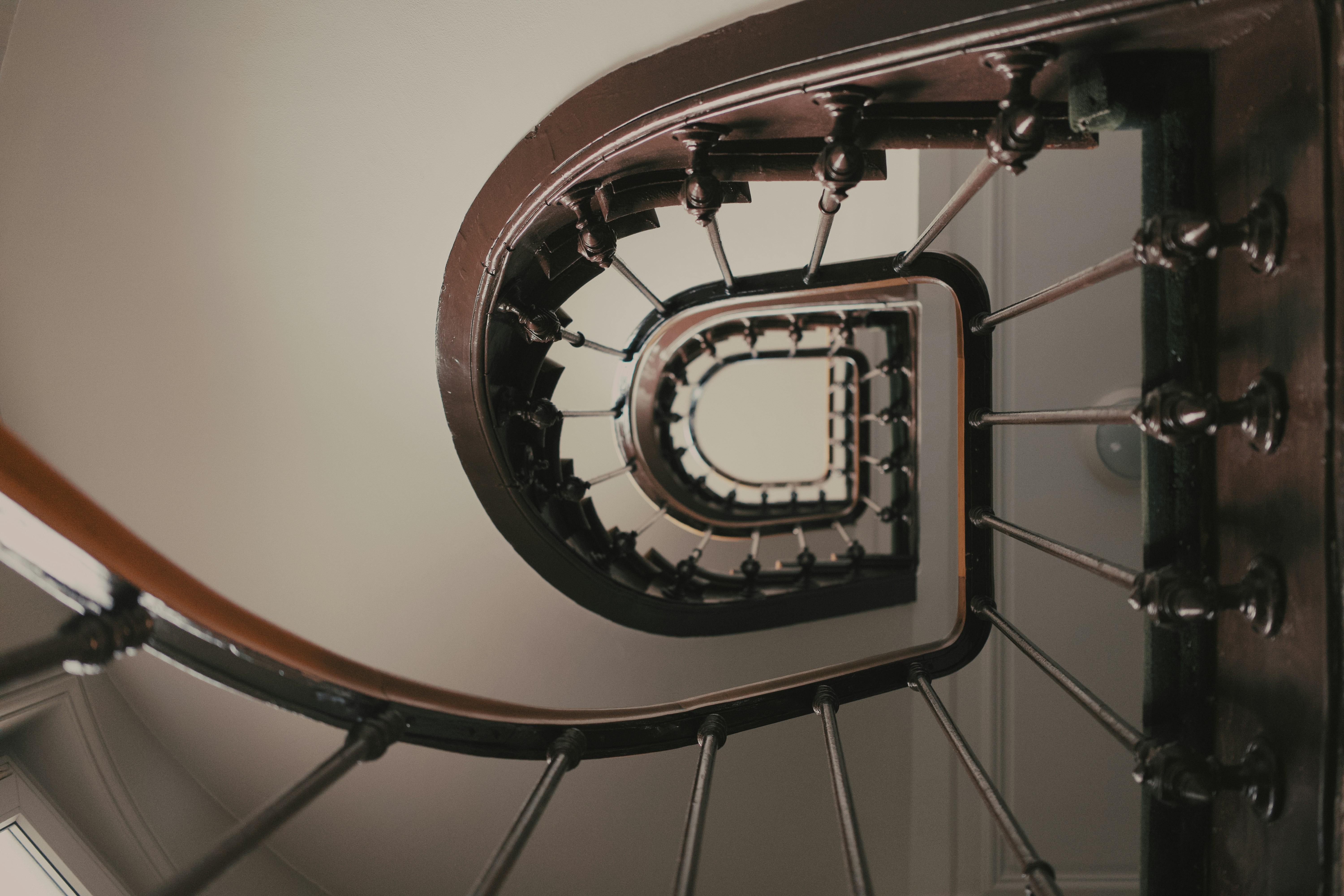 A view of a spiral staircase from below photo – Free House Image on ...