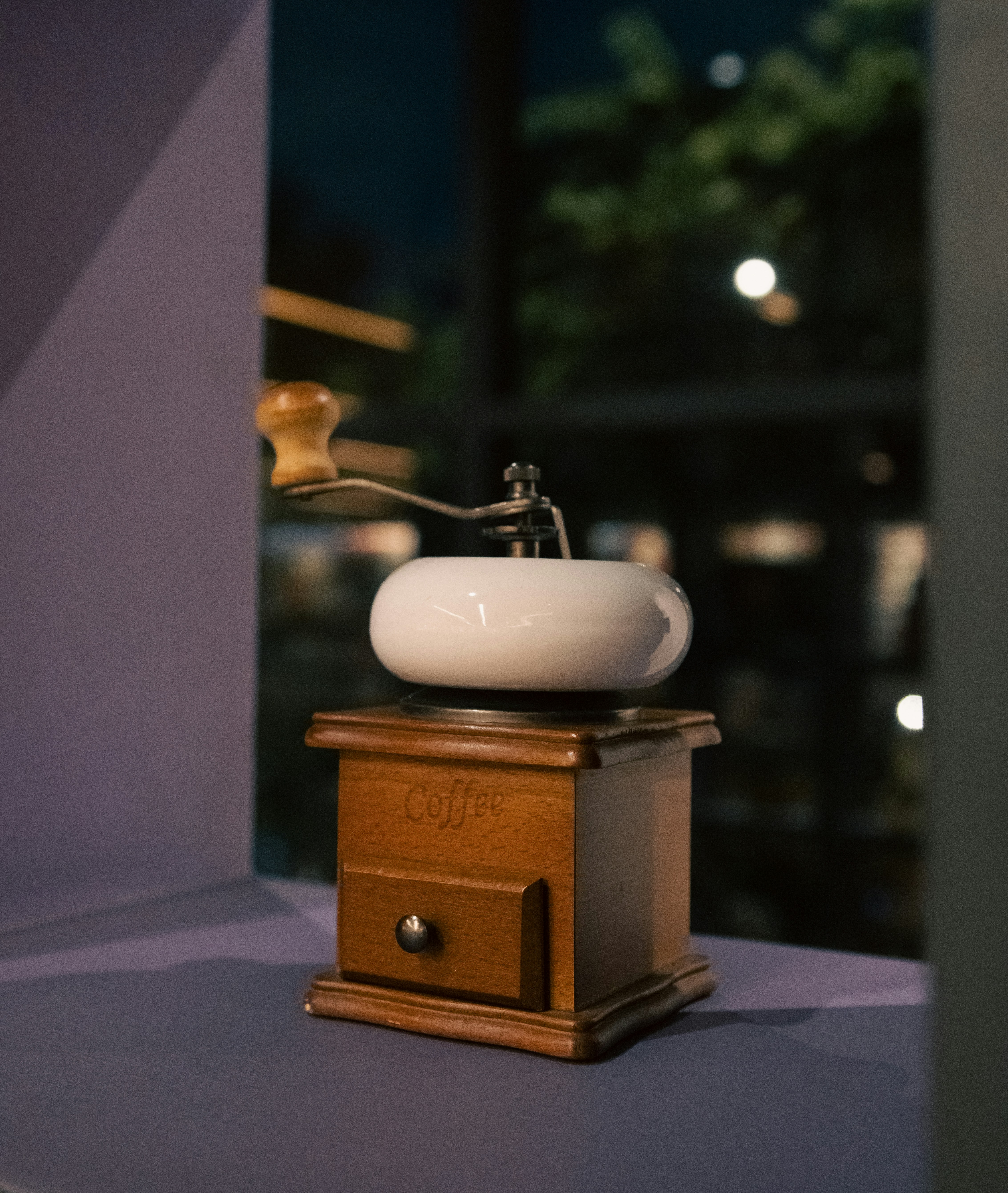 Quiet Roast: A Vintage Coffee Grinder Centered on Soft Evening Light