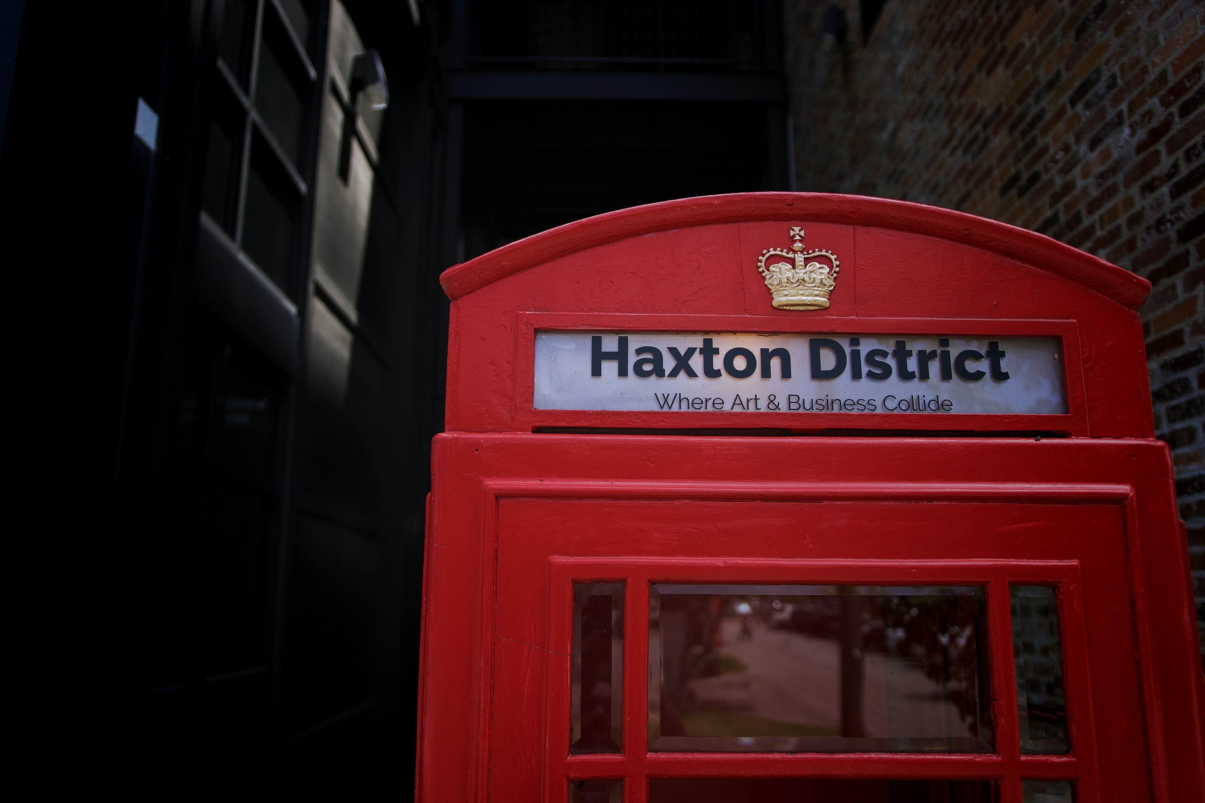A red phone booth with a crown on top of it photo – Free Bentonville ...