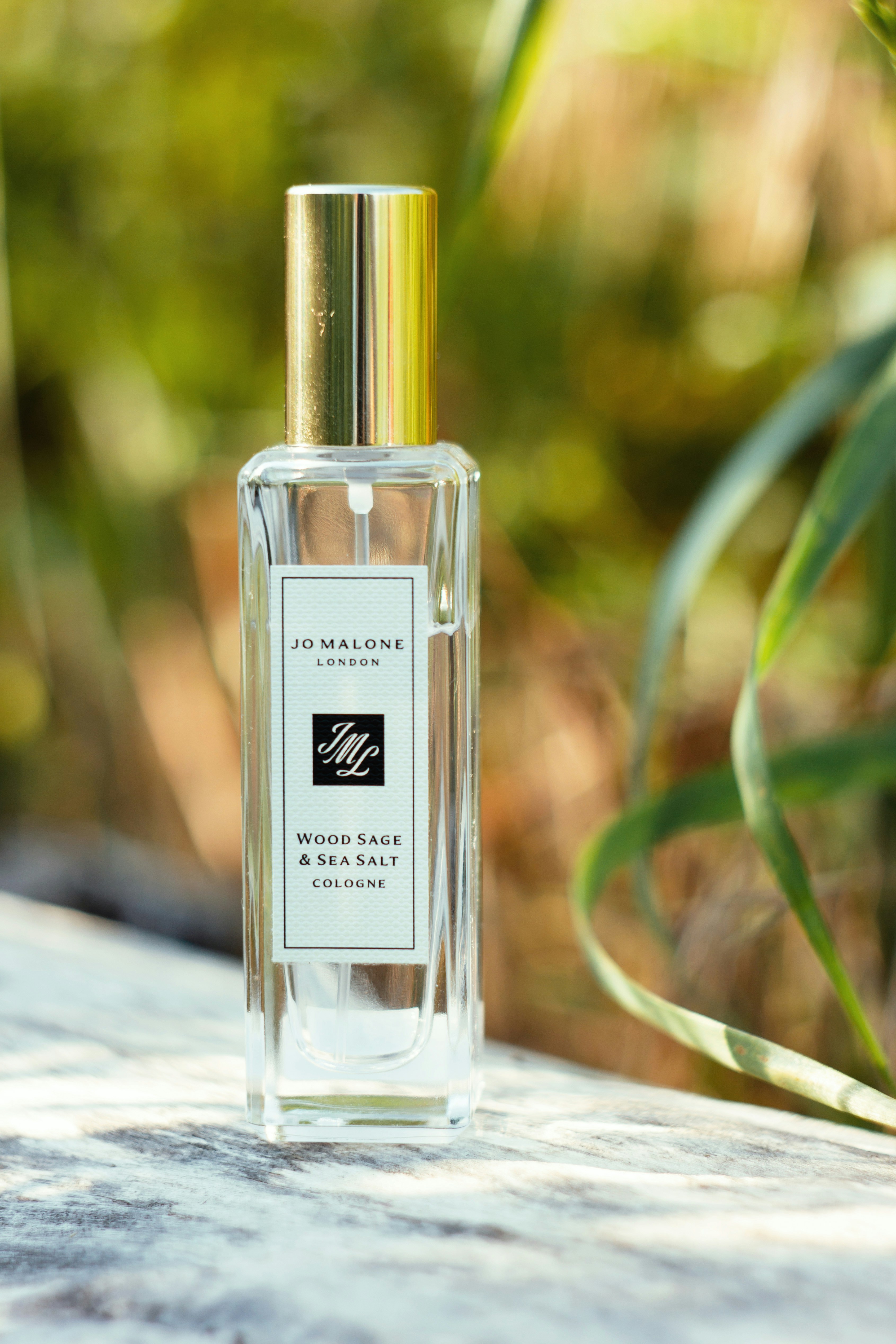 A bottle of cologne sitting on top of a table photo – Free Perfume ...