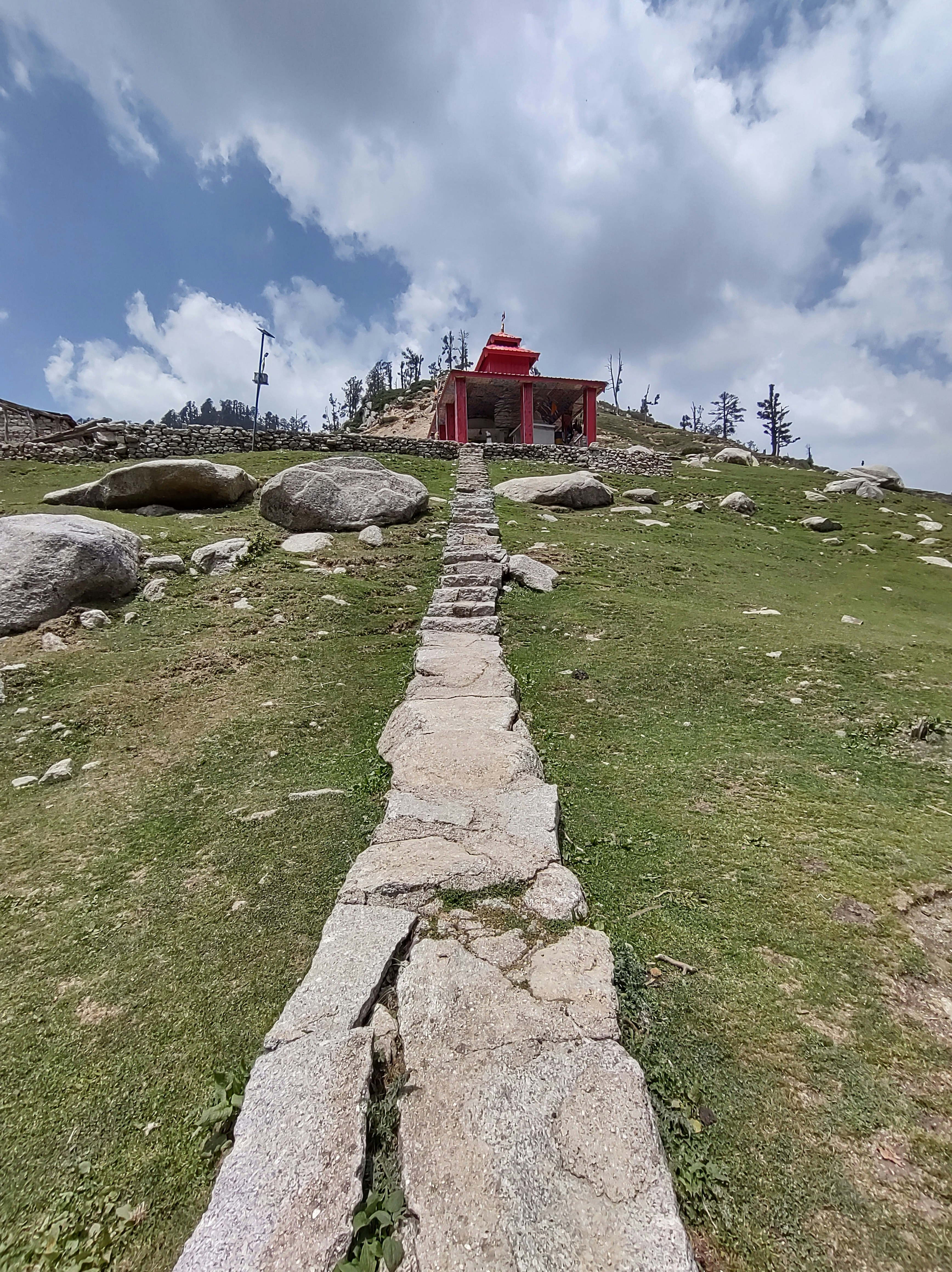 Crimson Pavilion at the End of a Stone Ribbon