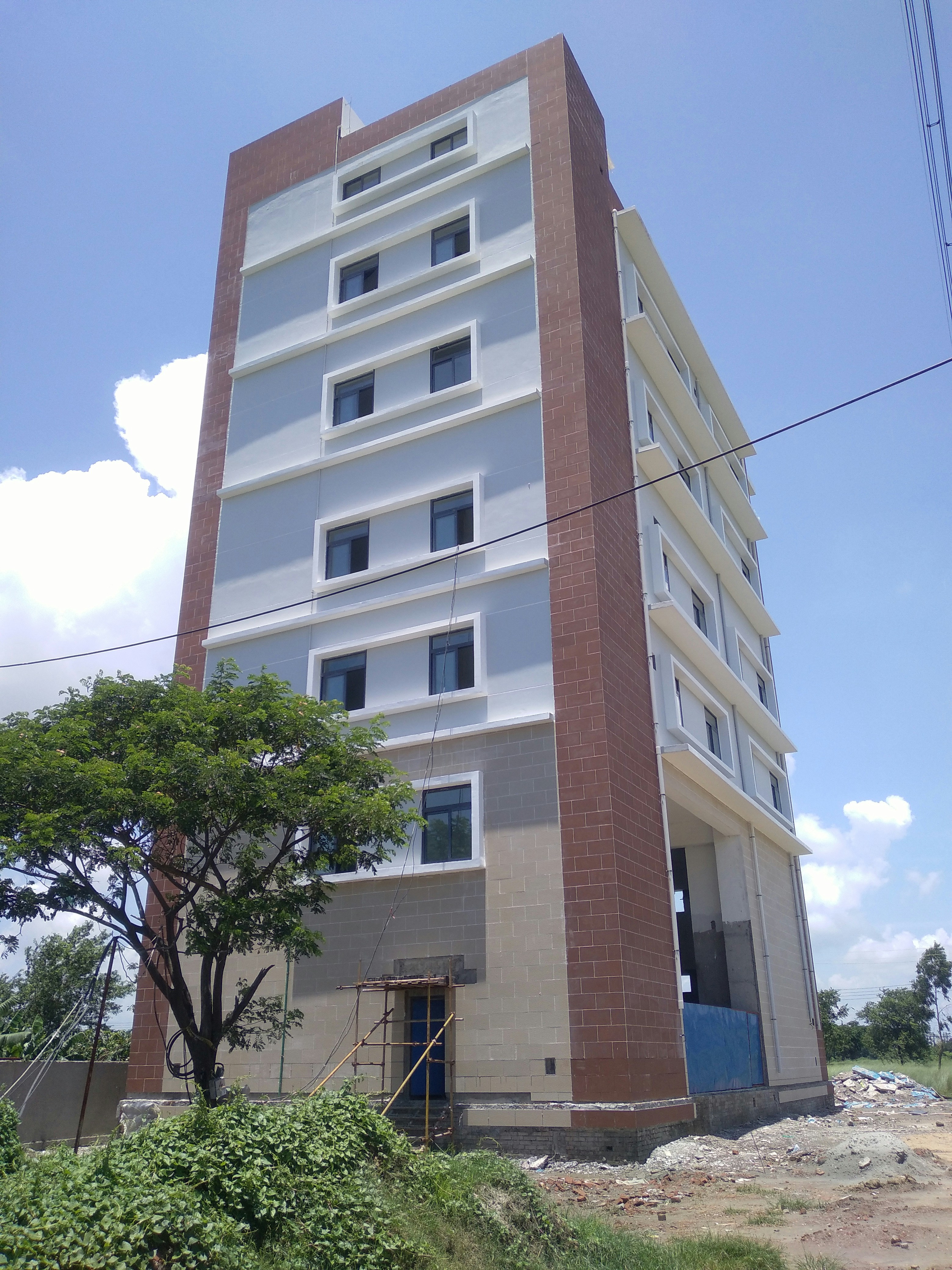 Skyward in Progress: A Brick-Framed Residential Tower Reaching for the Blue