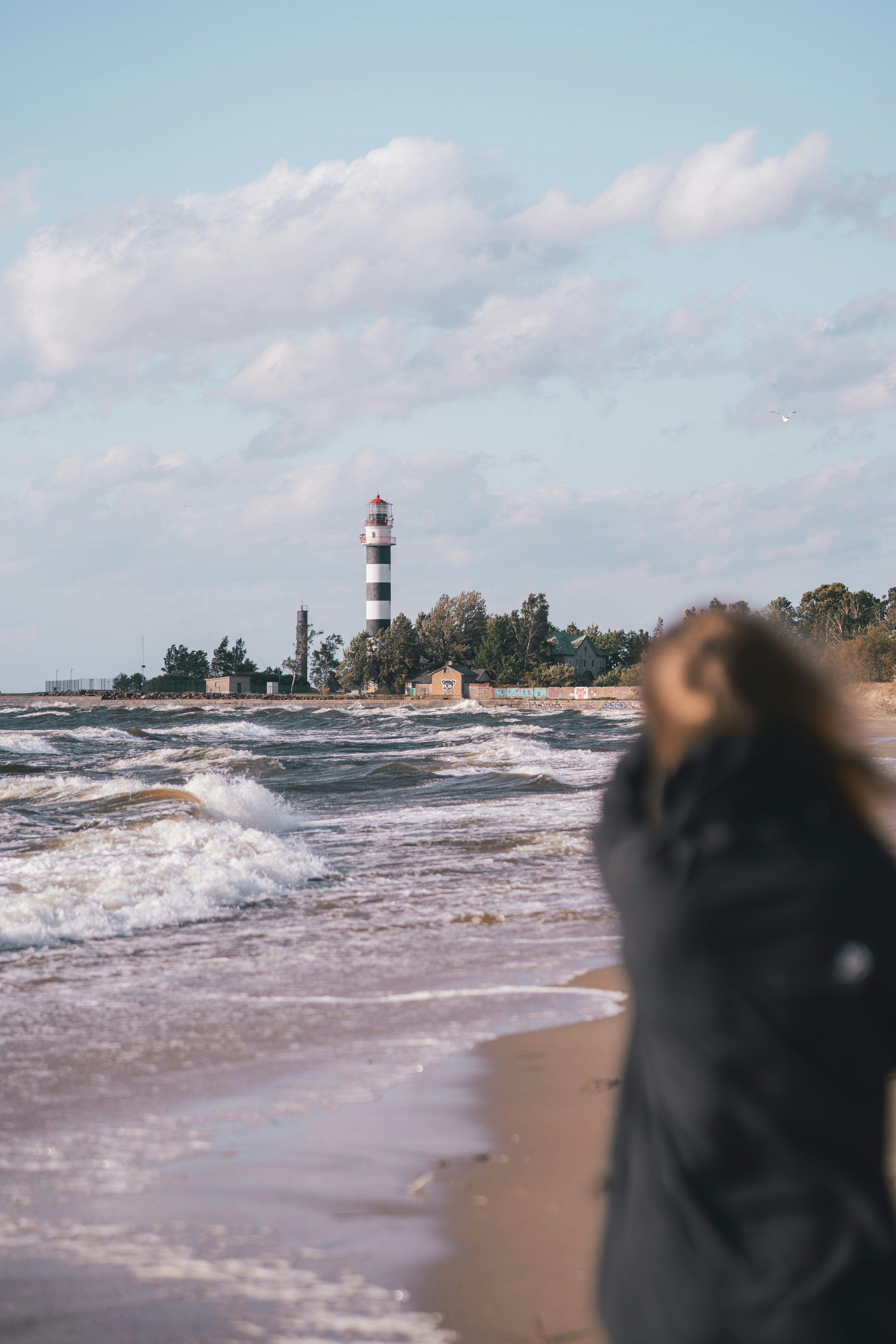 Lighthouse Vantage: Waves, Wind, and a Distant Beacon