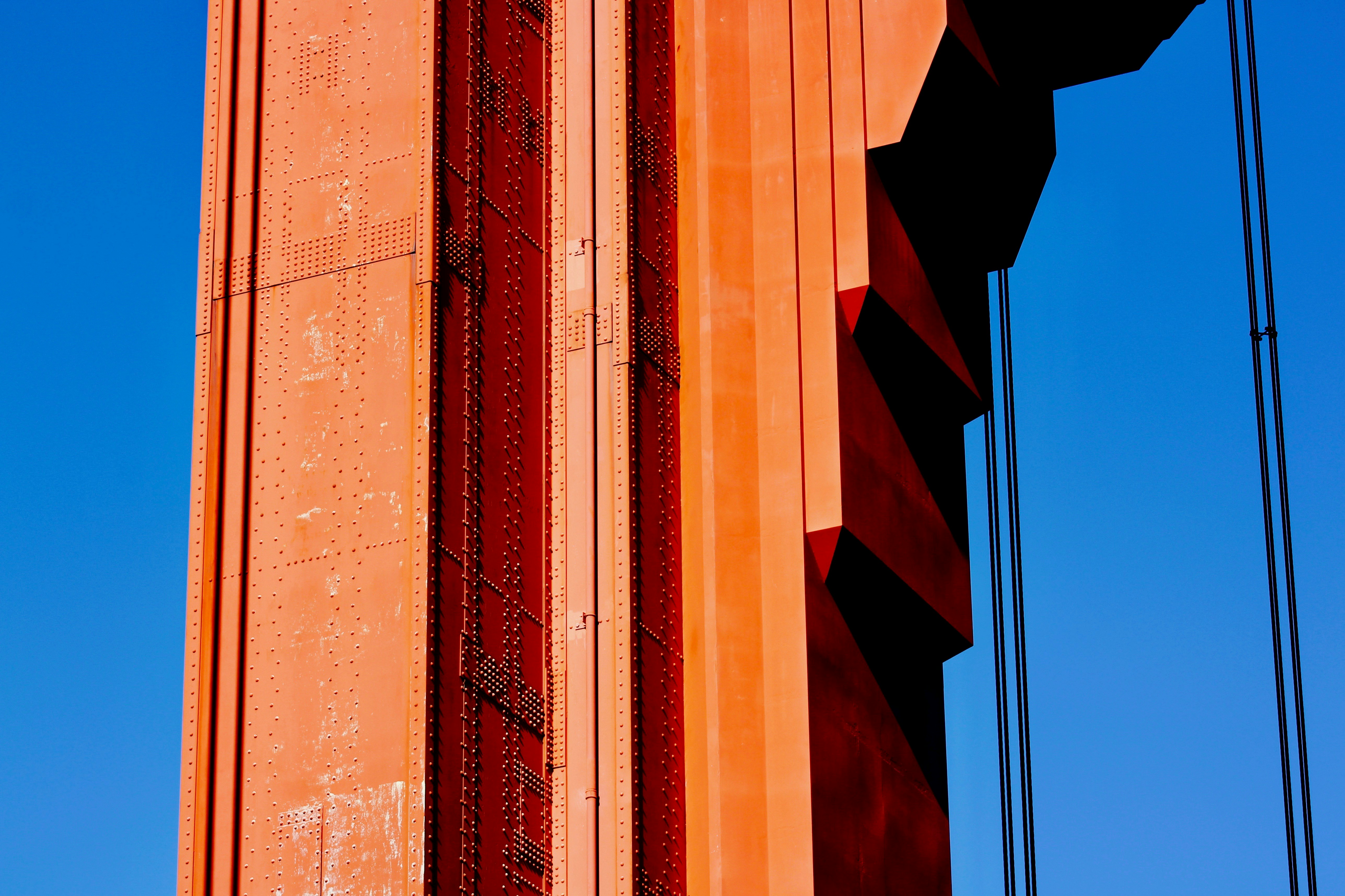 Ridge of Red Steel Against a Clear Blue Sky