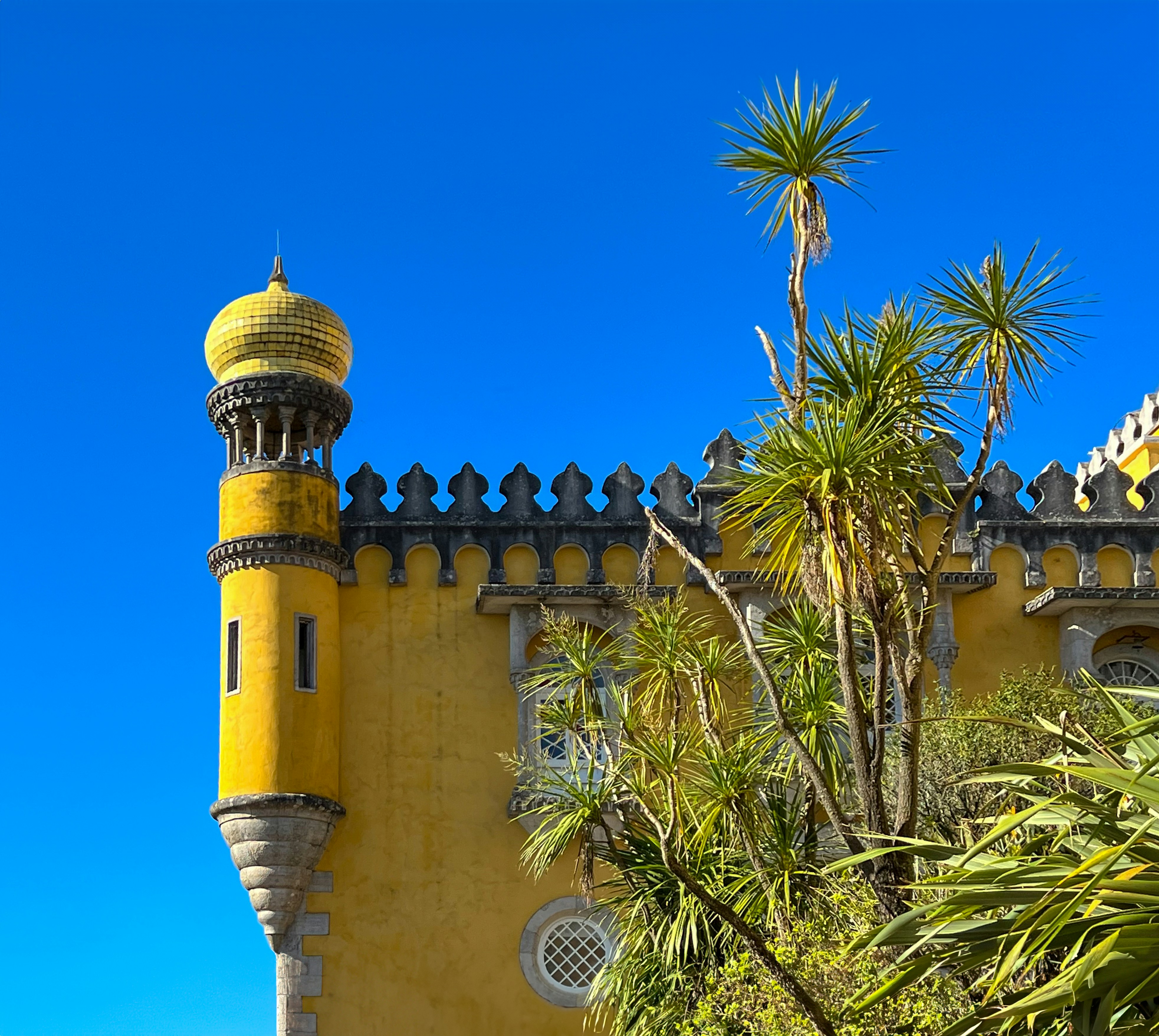 A tall yellow building with a yellow tower photo – Free Sintra Image on ...