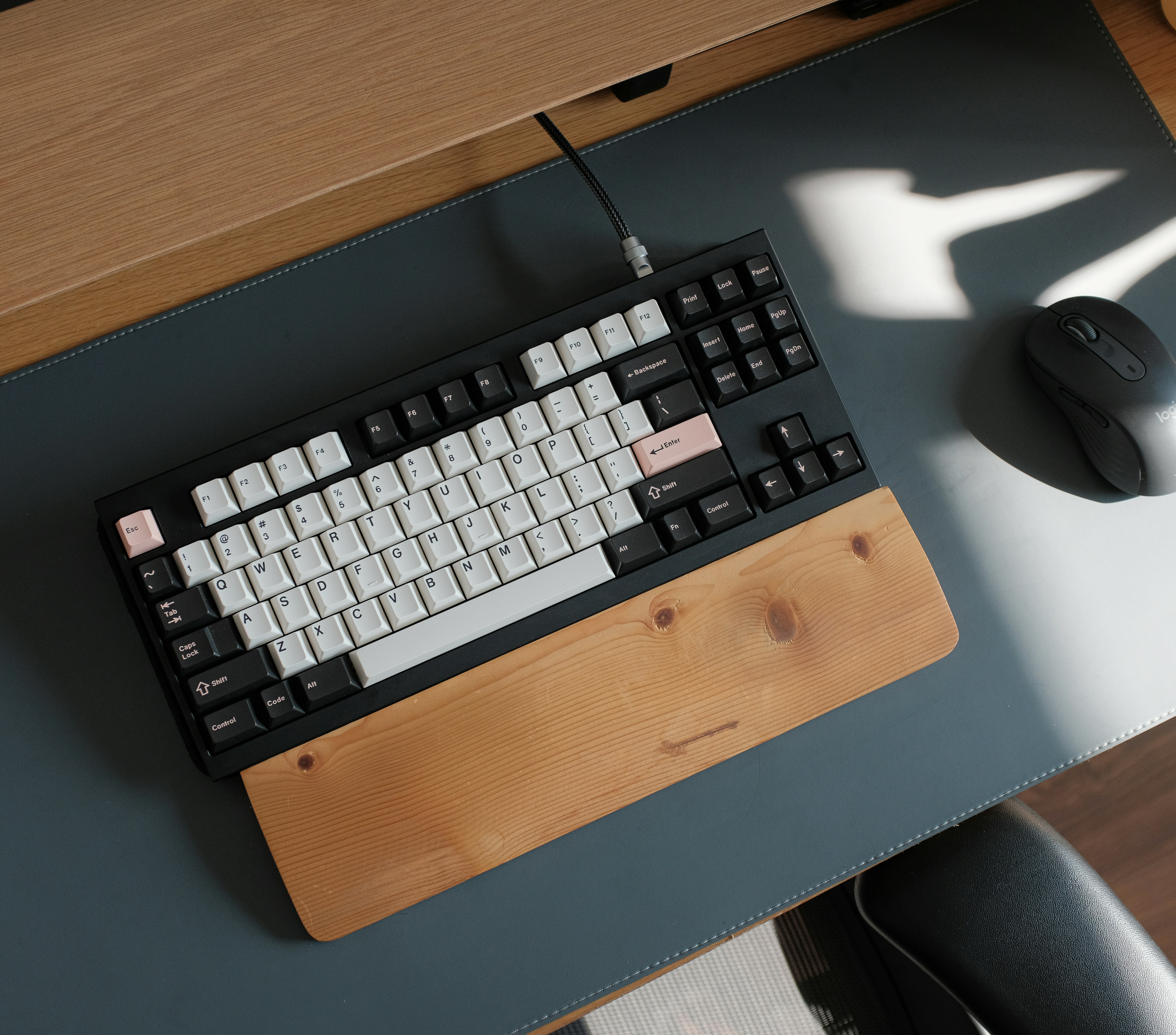 A computer keyboard sitting on top of a wooden desk photo – Free ...
