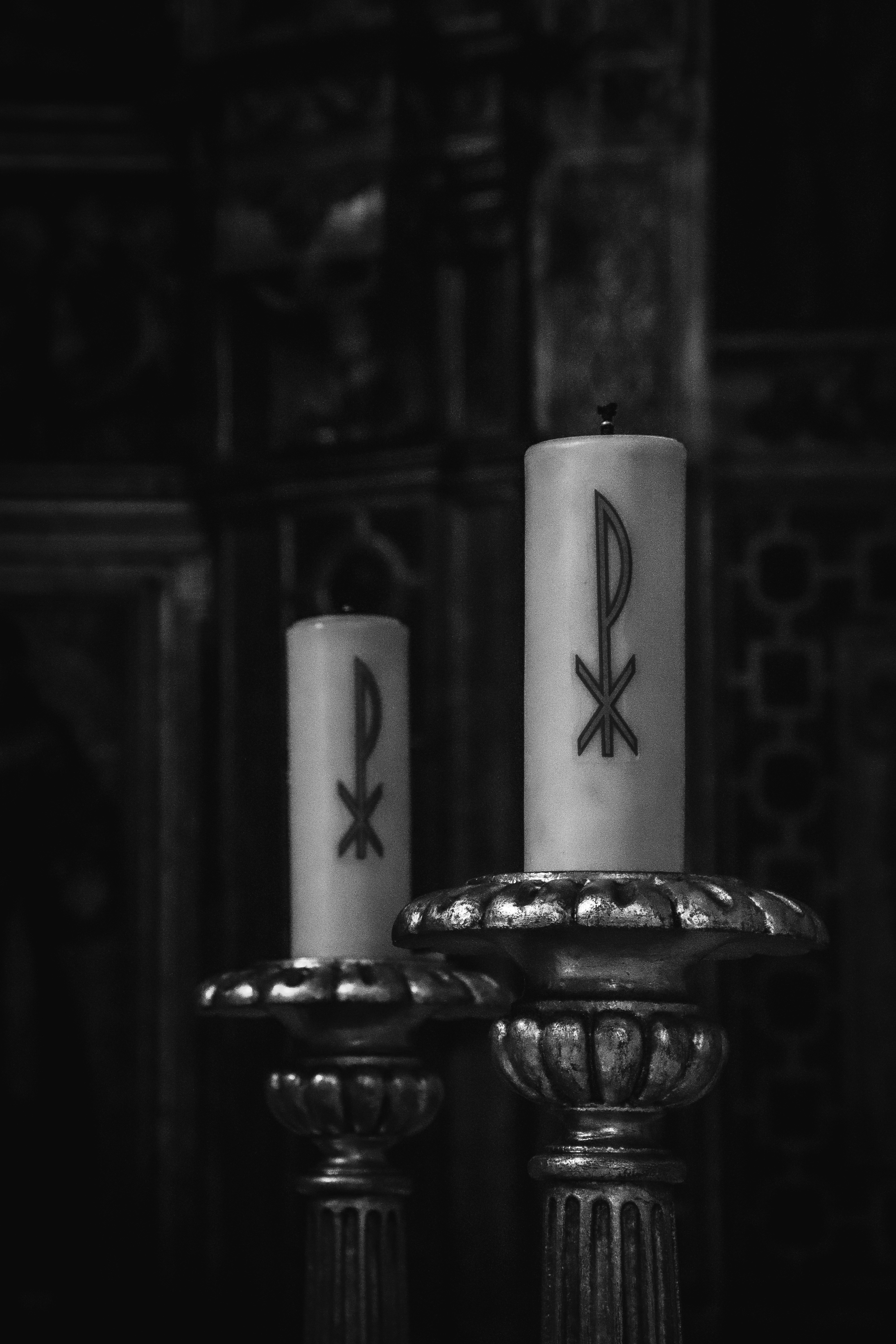 Candlelit Symbol: A Quiet Ritual in Monochrome