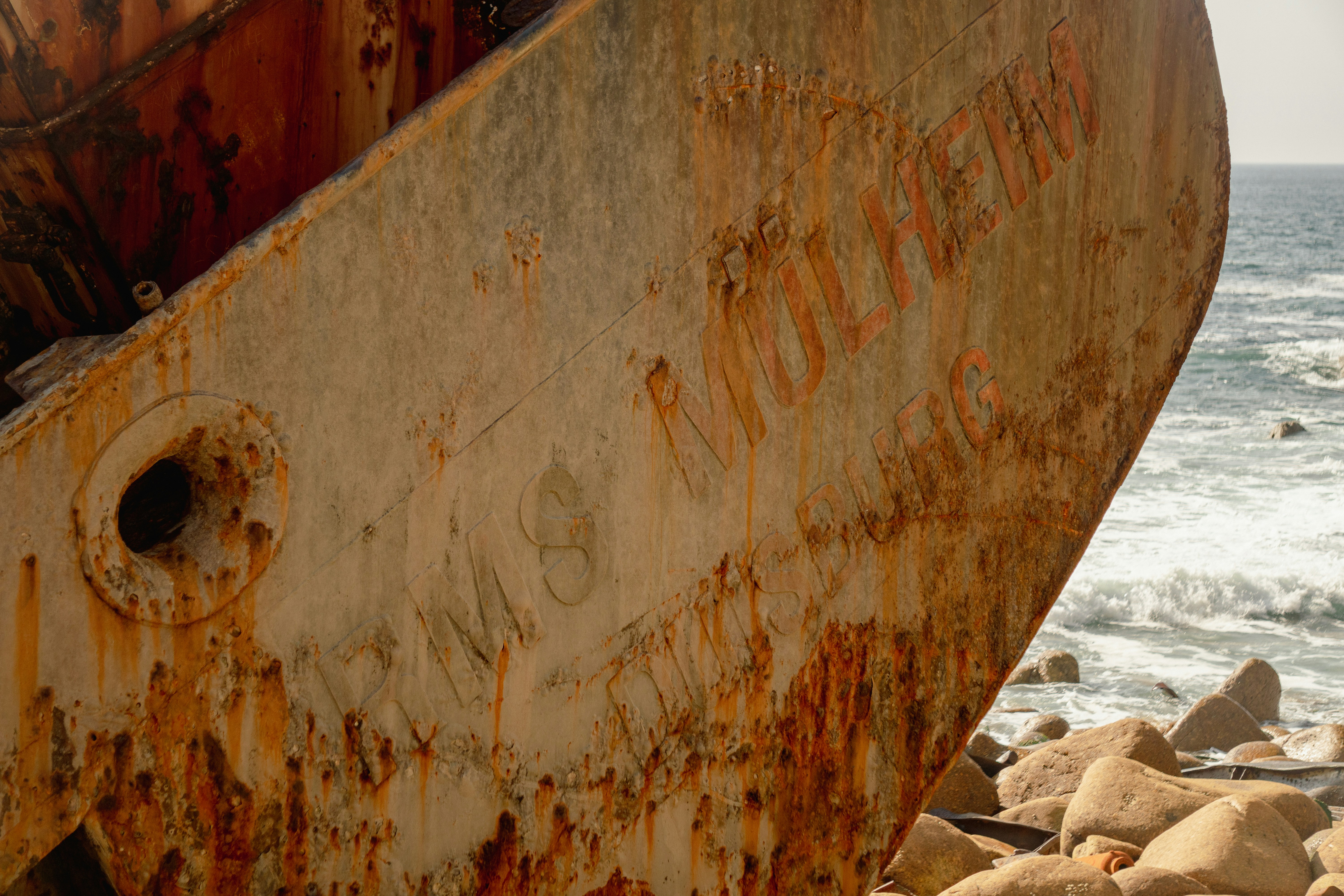 Rusted Hull by the Sea: Weathered Grit and Quiet Echoes