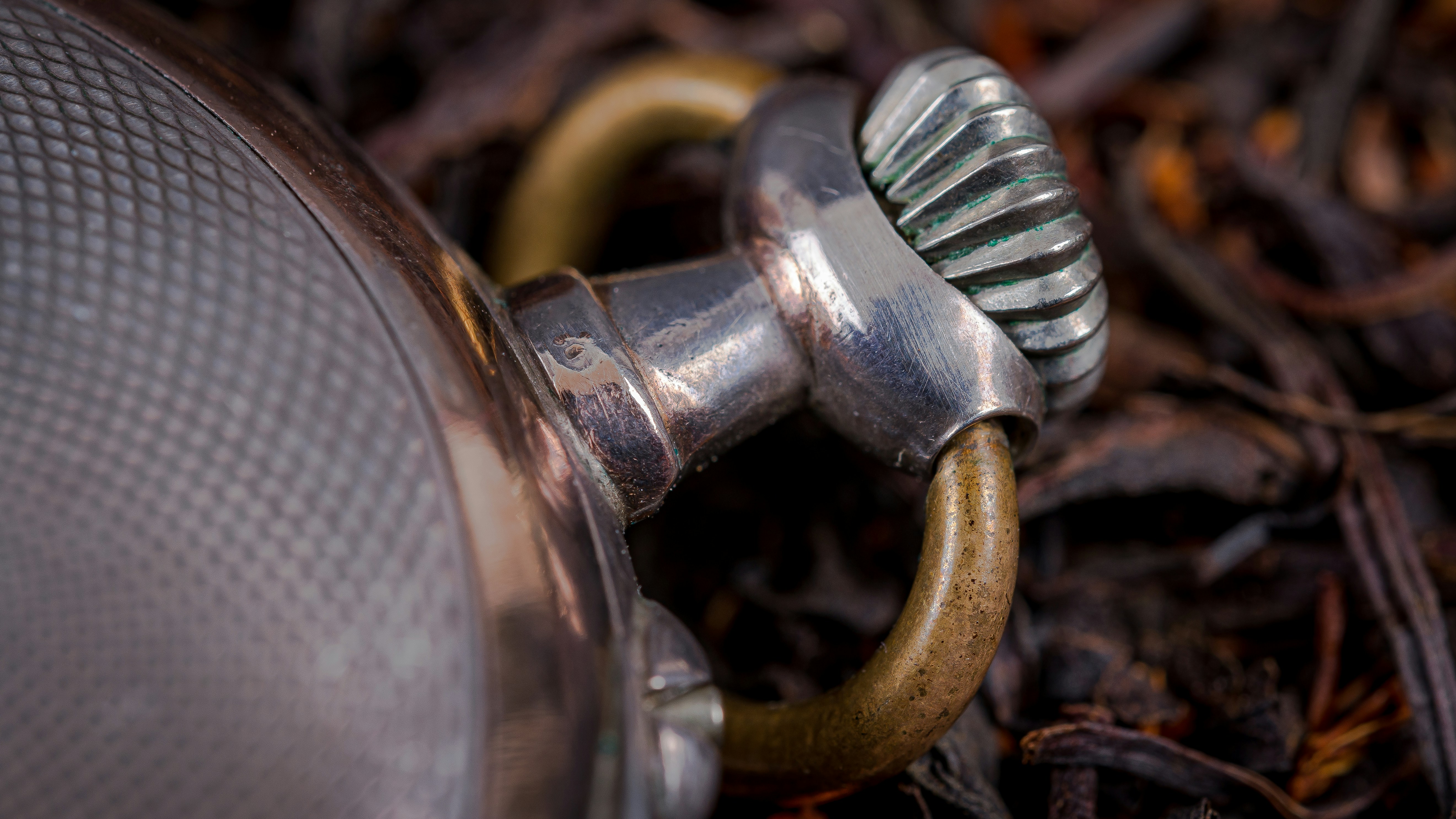 A close up of a metal object on the ground photo – Free Hour Image on ...