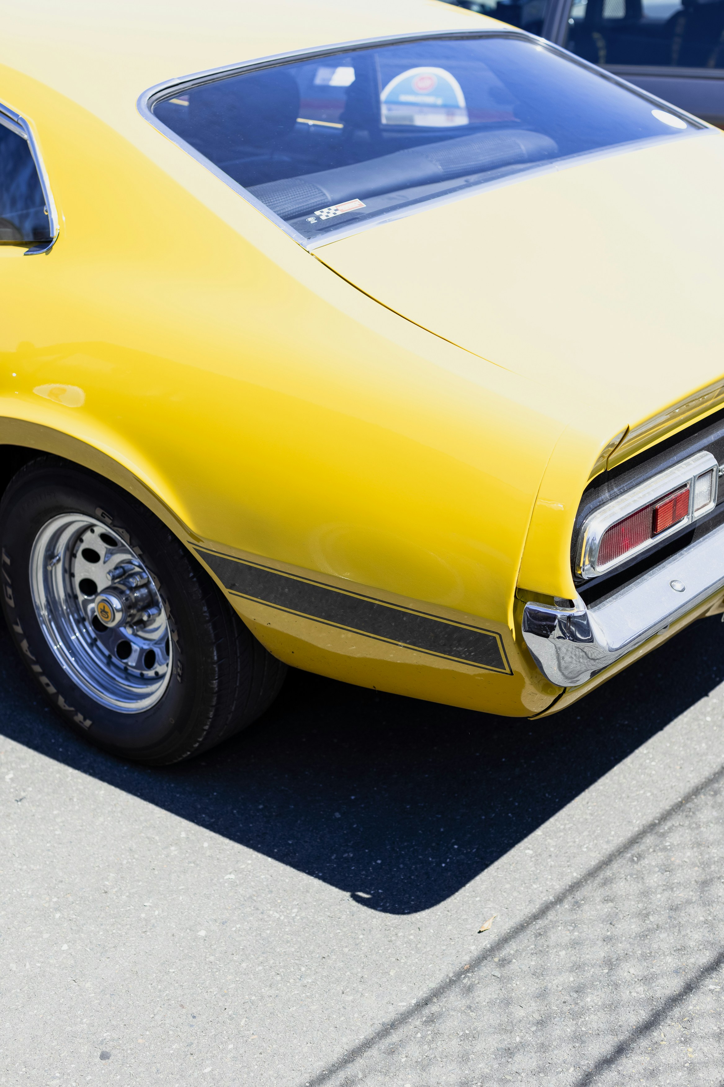 A yellow car parked in a parking lot photo – Free Norisring Image on ...