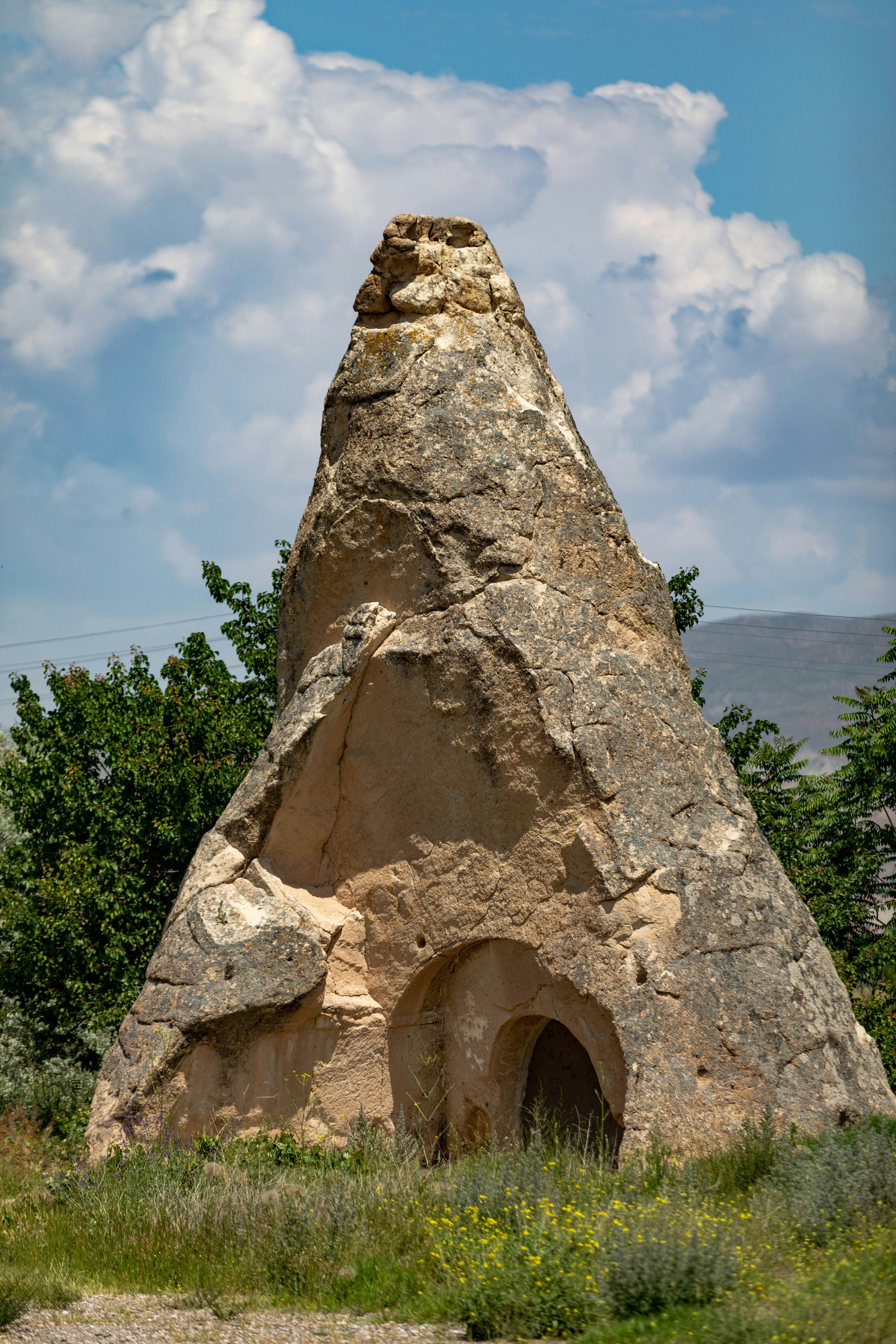 A large rock with a small cave in it photo – Free Rock Image on Unsplash