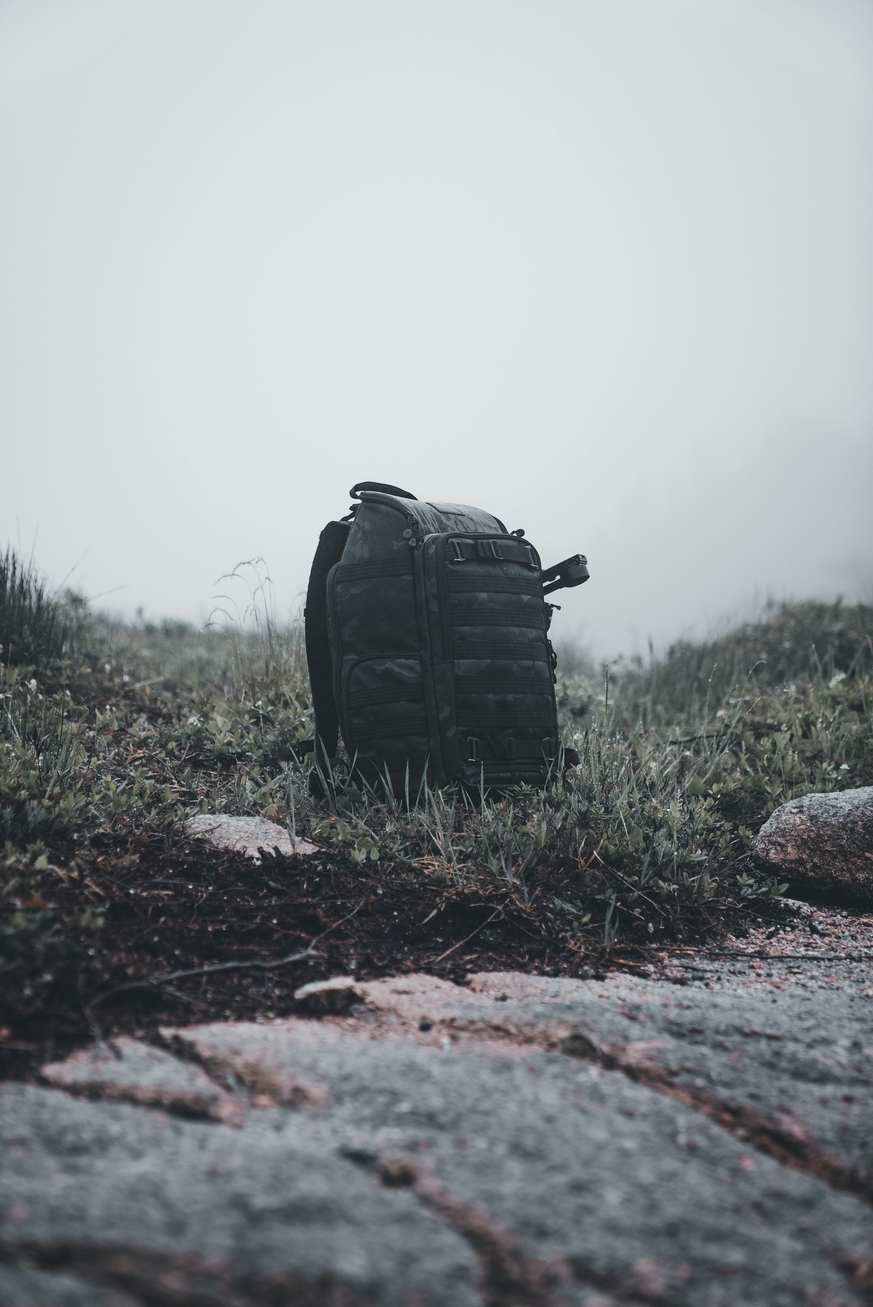Mistbound Pack: A Lone Backpack Anchored on a Quiet, Foggy Trail