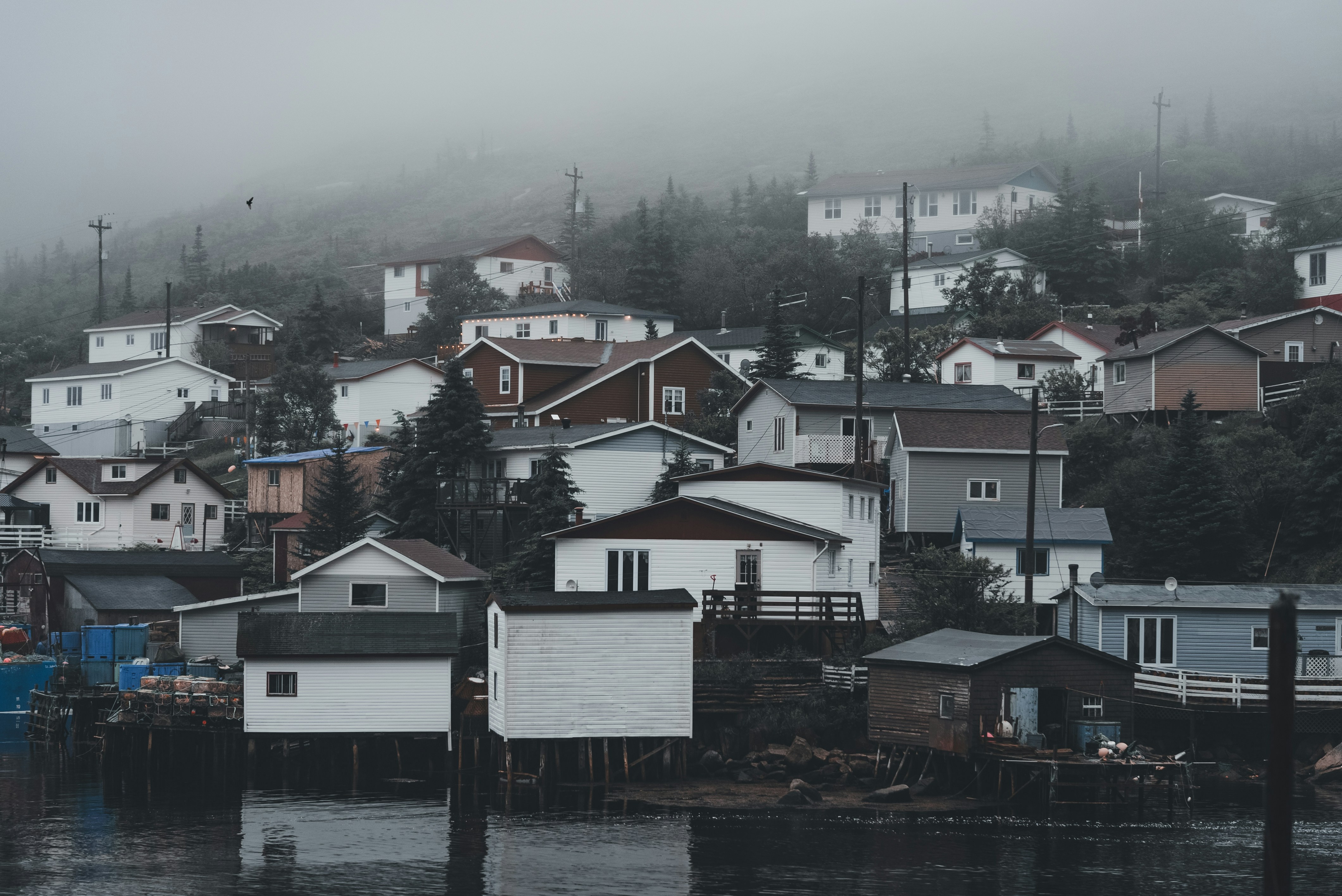 Mist-Softened Row of Seaside Cabins on the Waterfront
