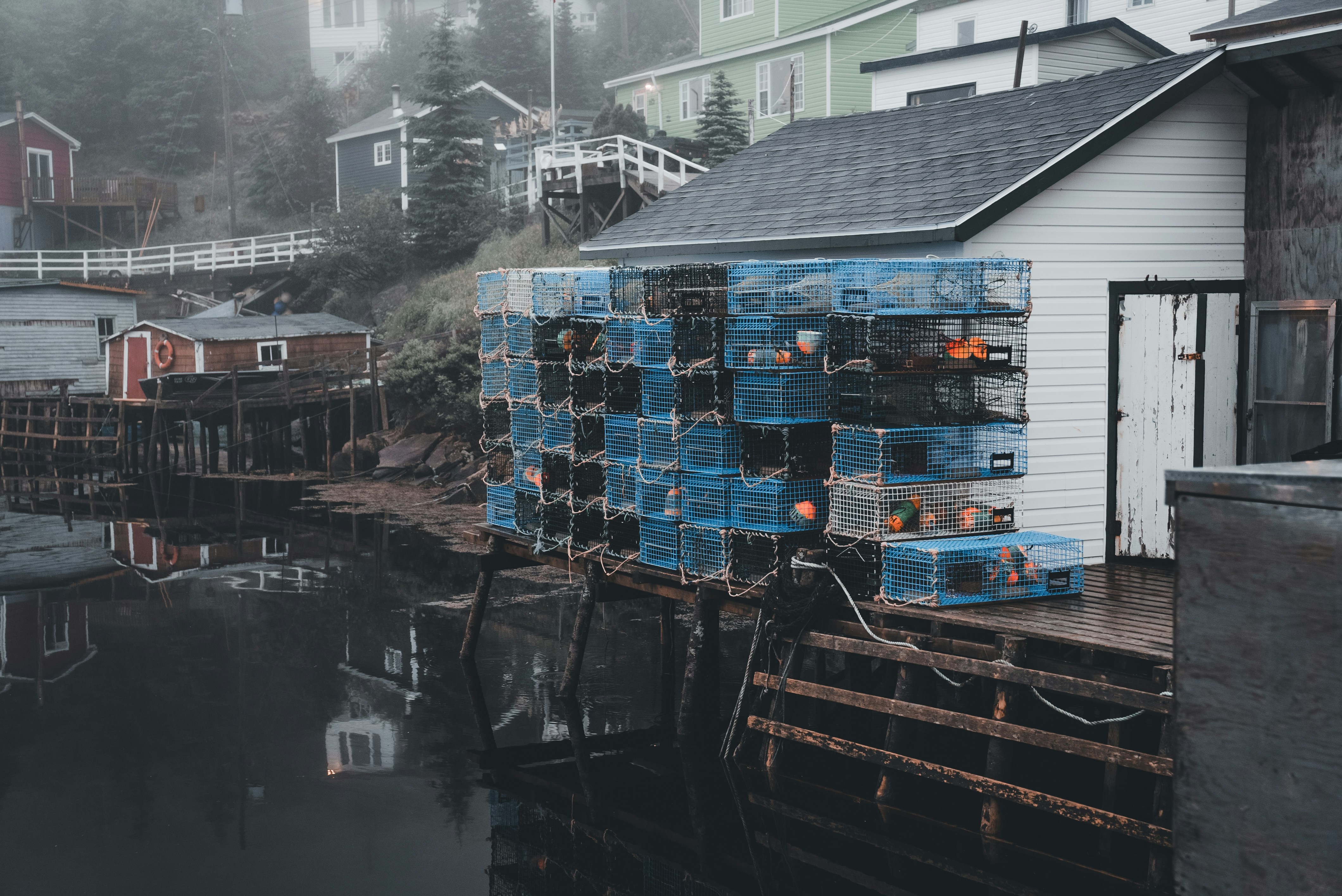 Blue Crate Stack at a Misty Harbor