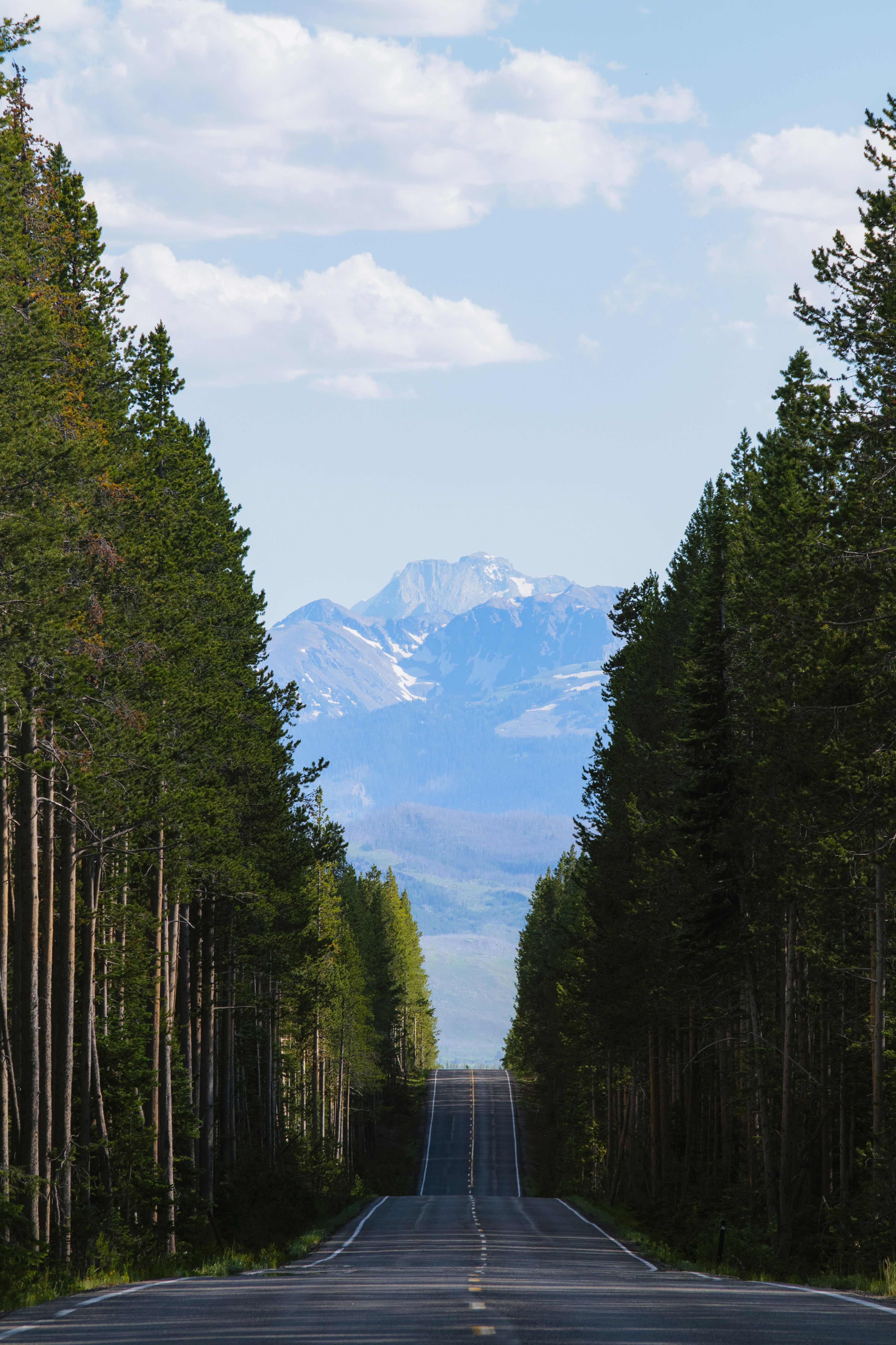 A long road with a mountain in the distance photo – Free Yellowstone ...
