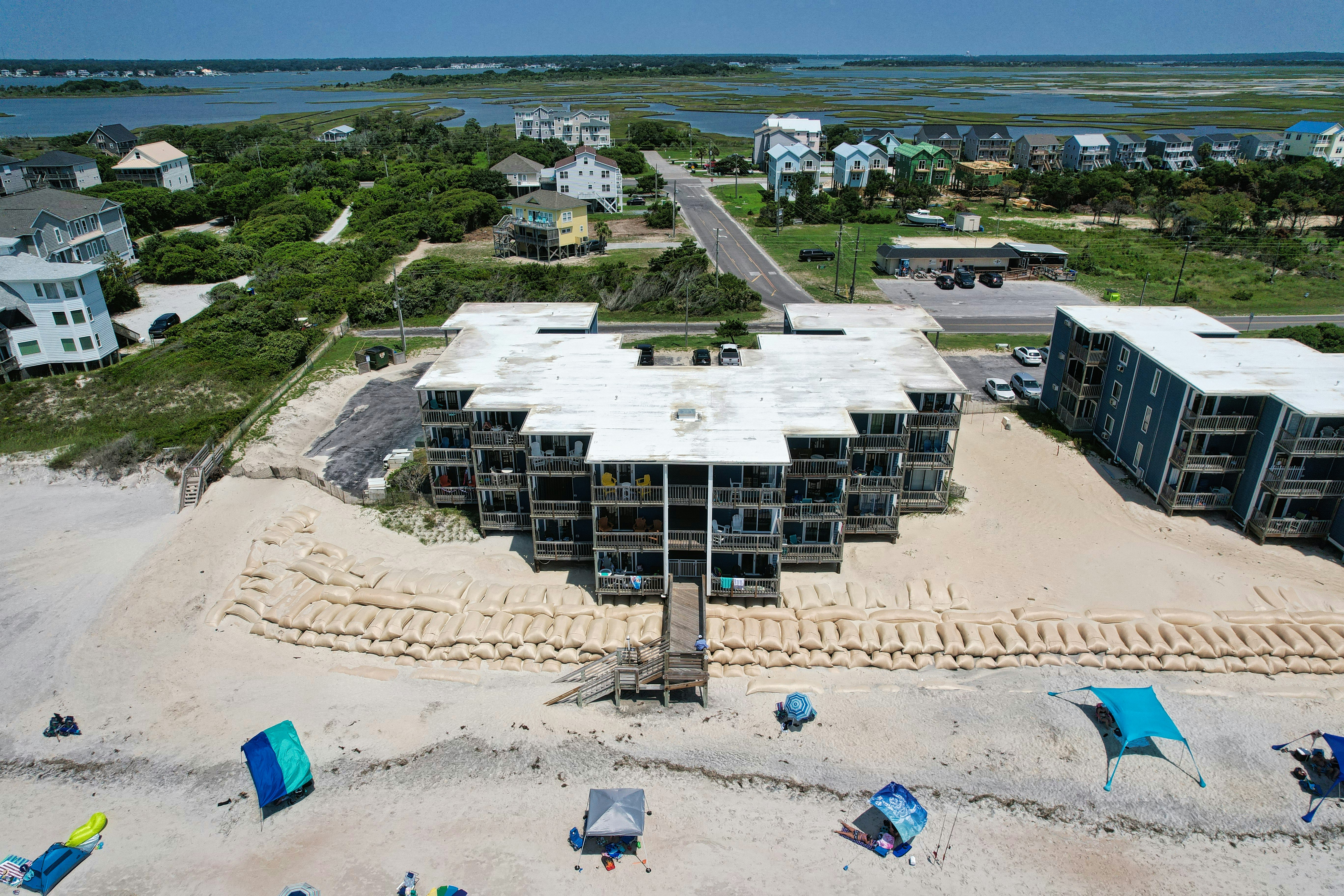 An aerial view of a beach with a building under construction photo ...