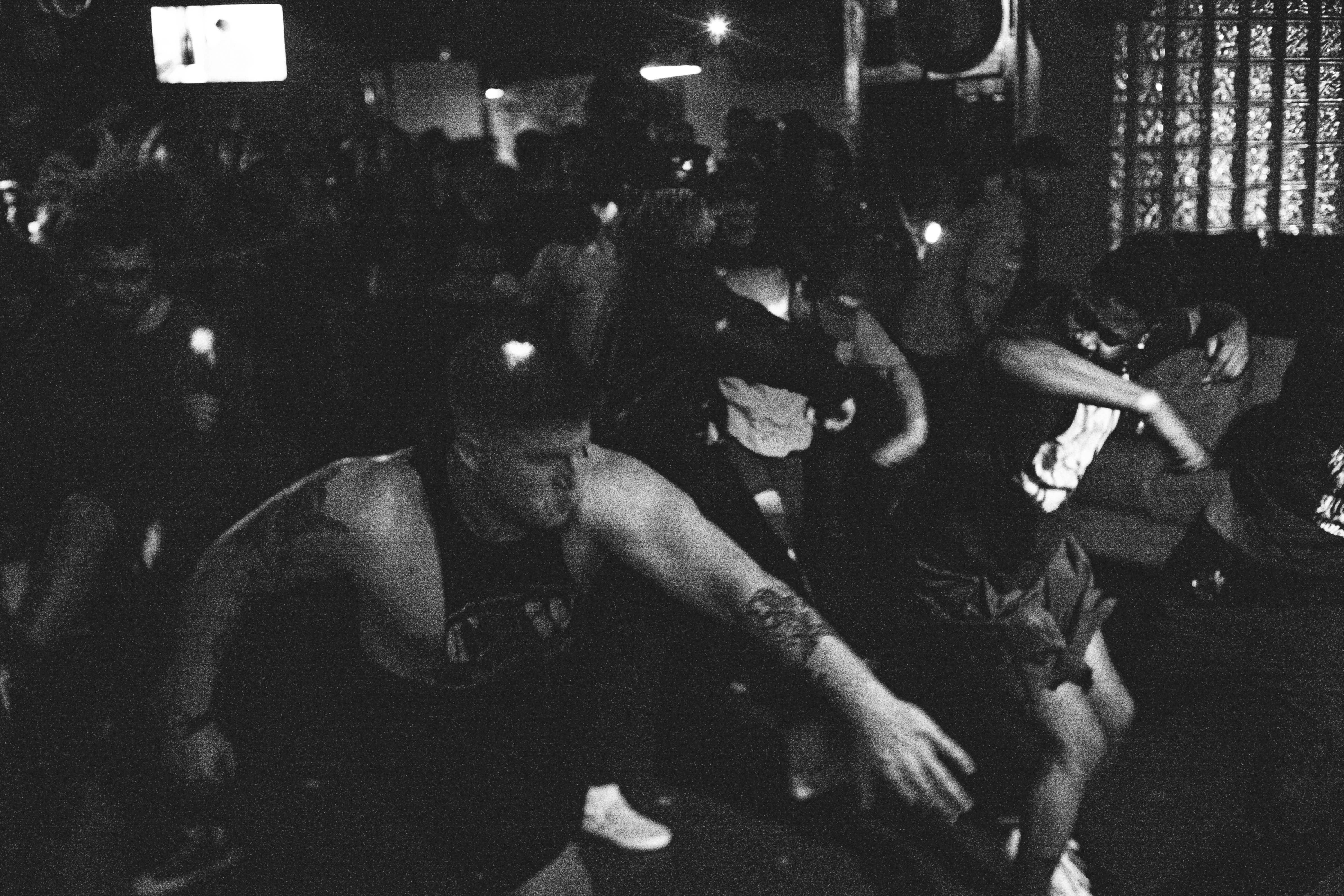 A black and white photo of a group of people dancing photo – Free Man ...