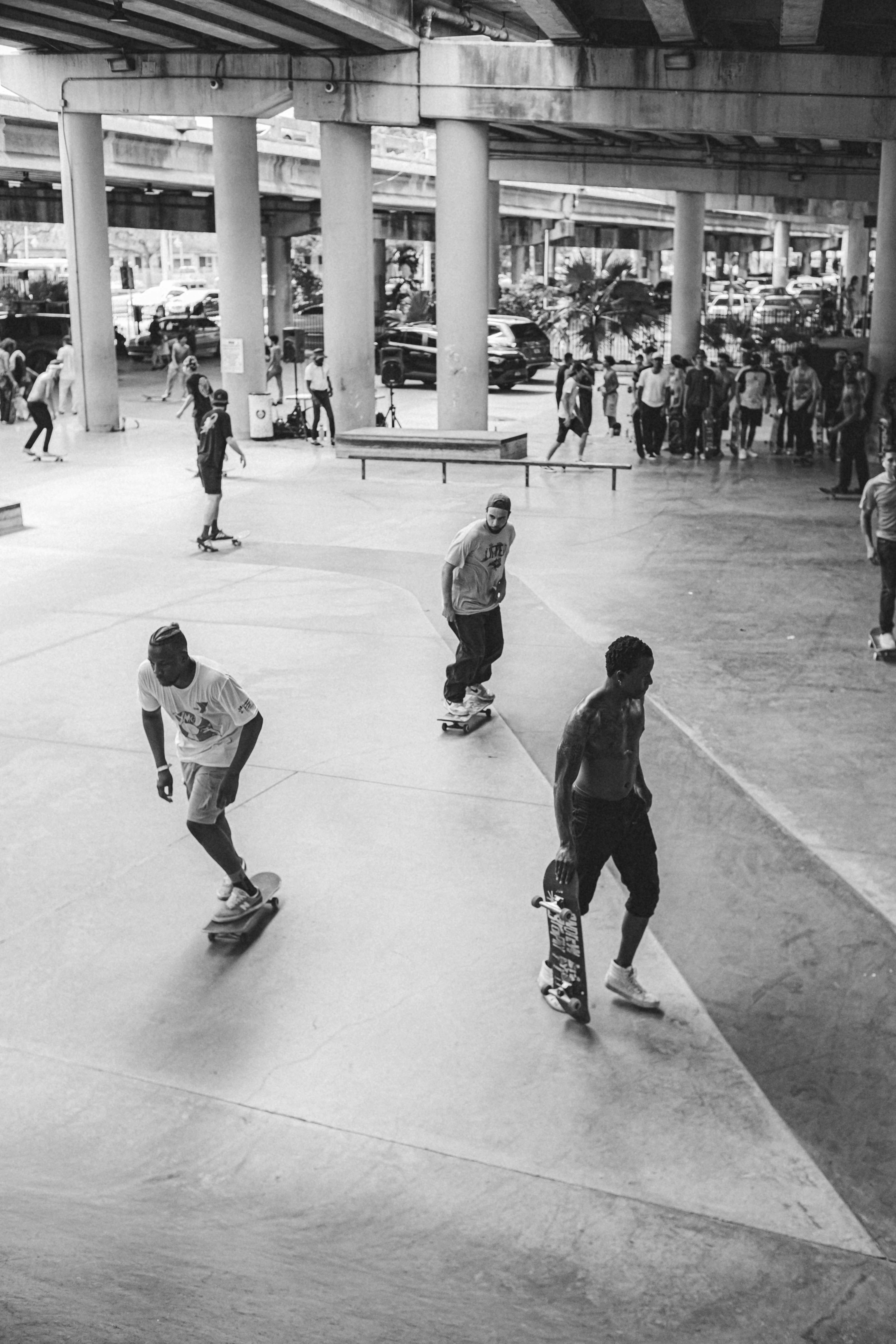 A group of people riding skateboards in a skate park photo – Free Image ...