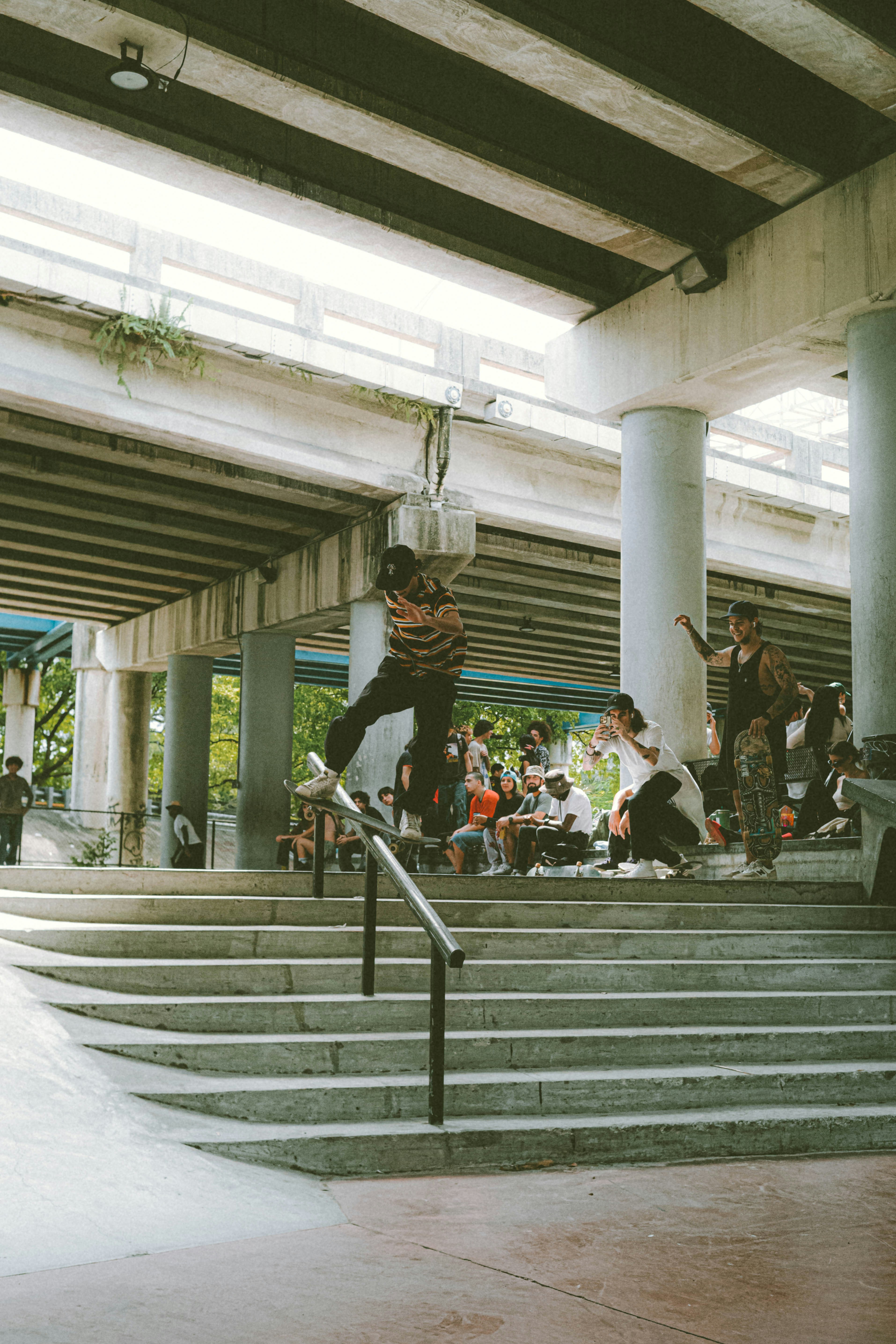 A man riding a skateboard down the side of a set of stairs photo – Free ...