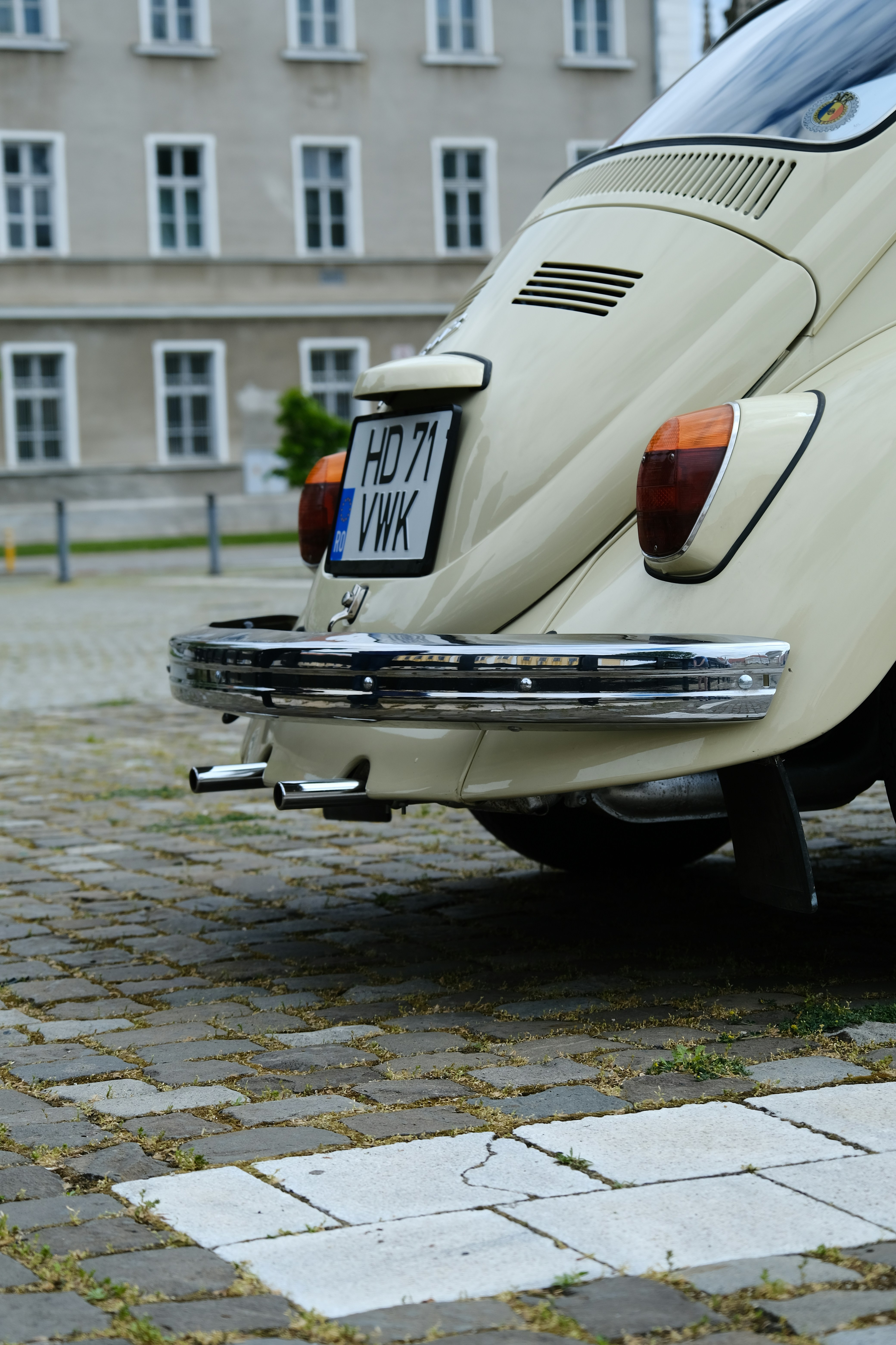 Back end of a wolkswagen buggy with the shining chrome on display.