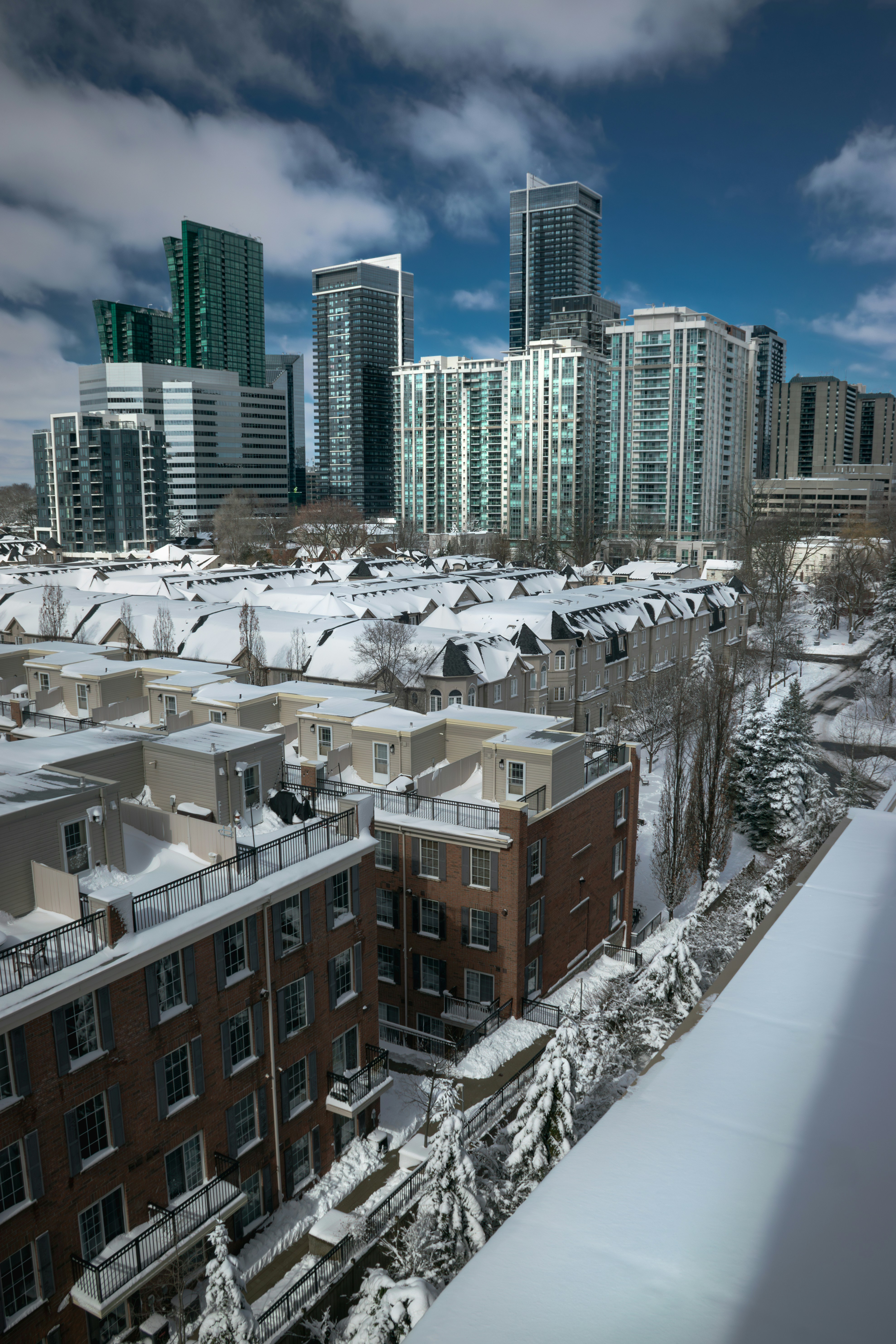 View of Toronto after a snow storm. North York neighborhood; blue sky with clouds after the storm; Canada, Mar/23.