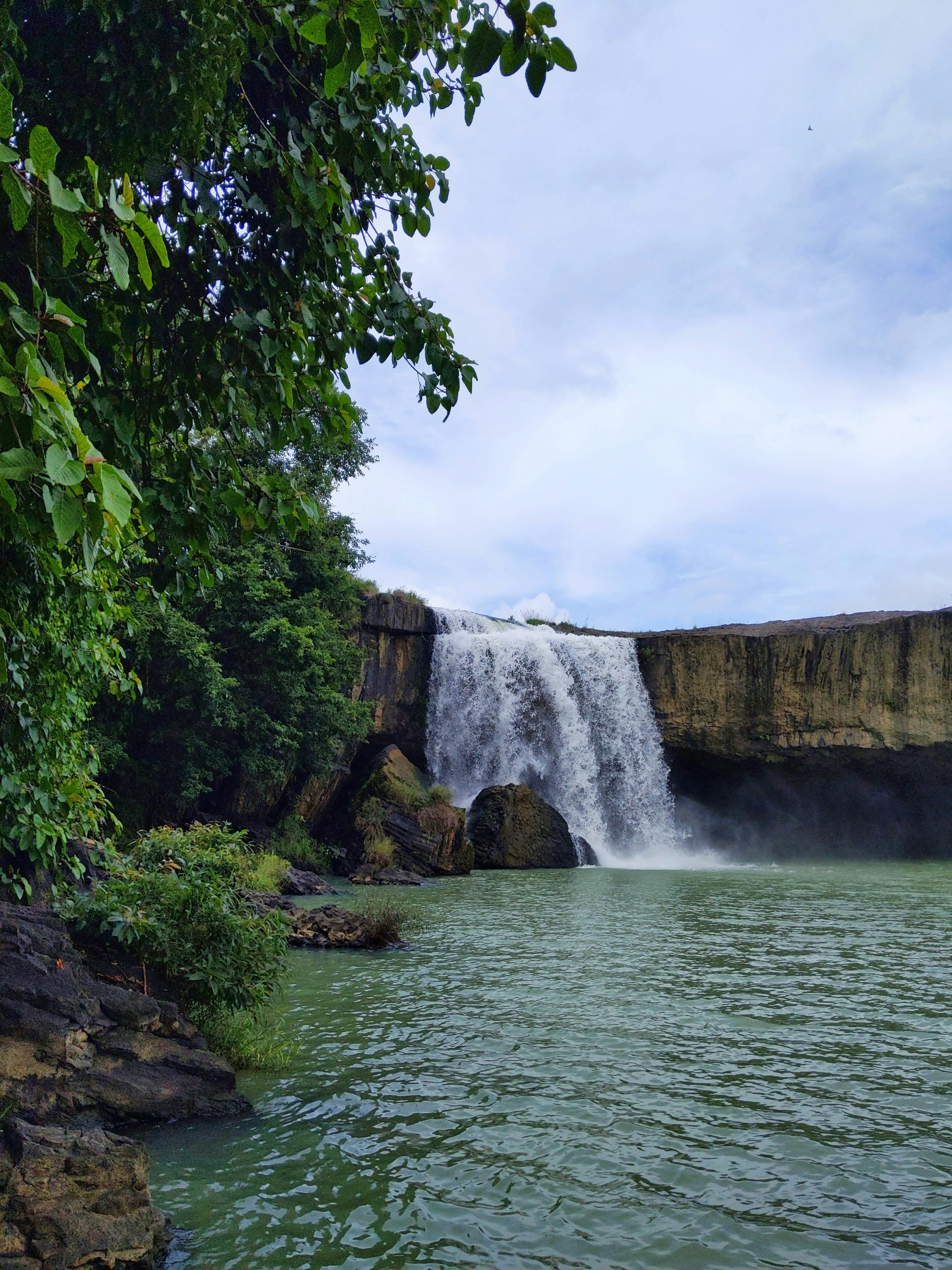 A waterfall with a large waterfall coming out of it photo – Free Dray ...