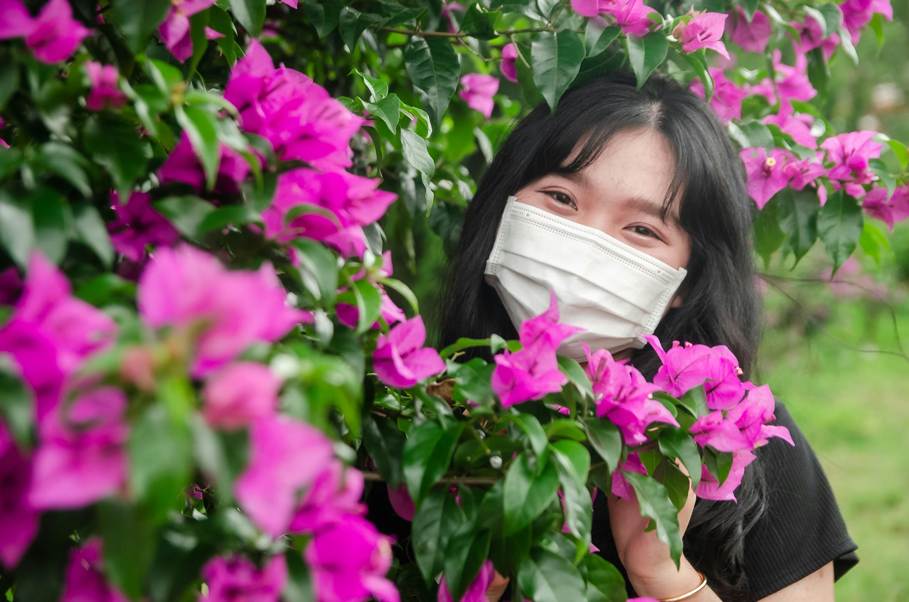 Masked Moment Among Magenta Bougainvillea