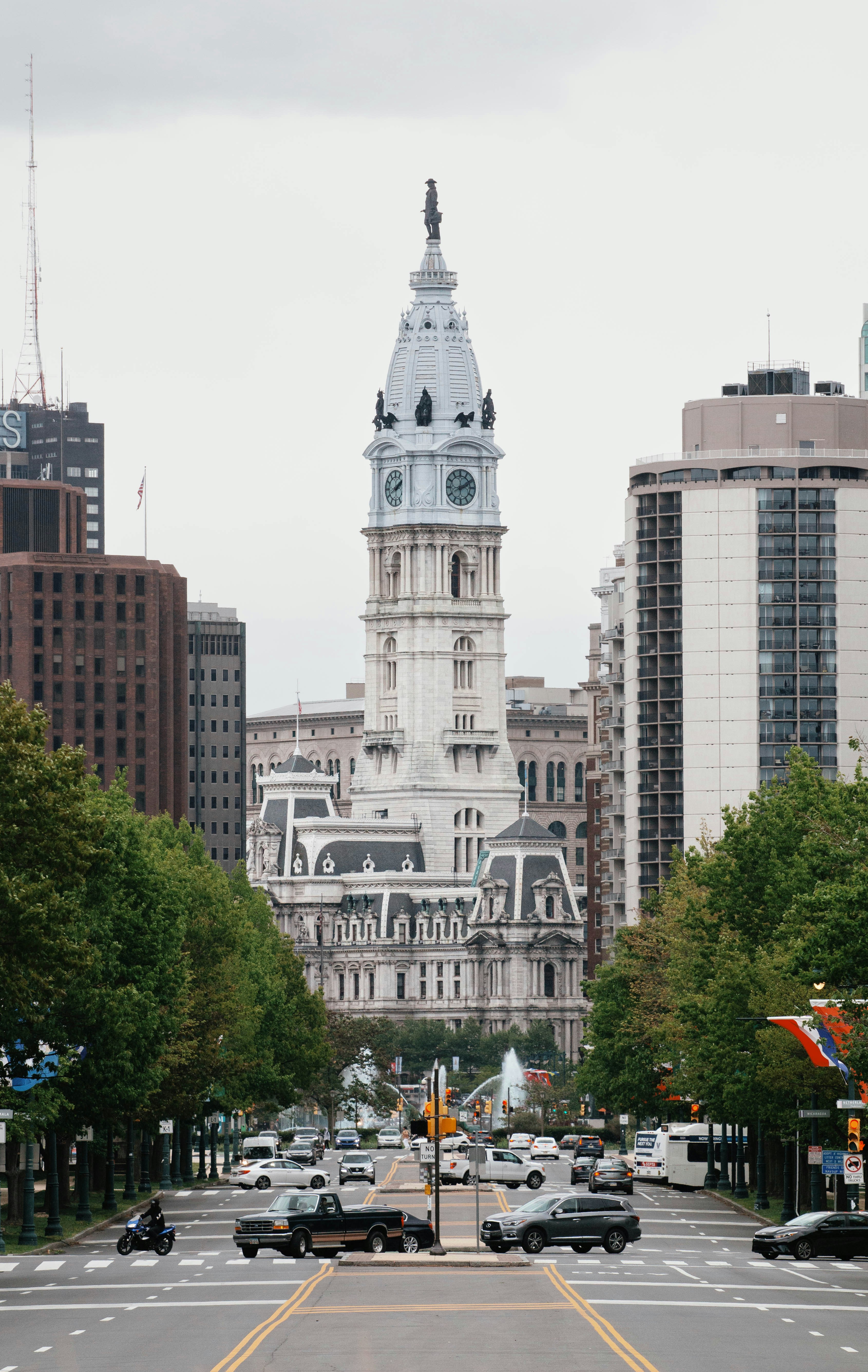 Philadelphia City Hall Clock Tower Framed by a Tree-Lined Avenue