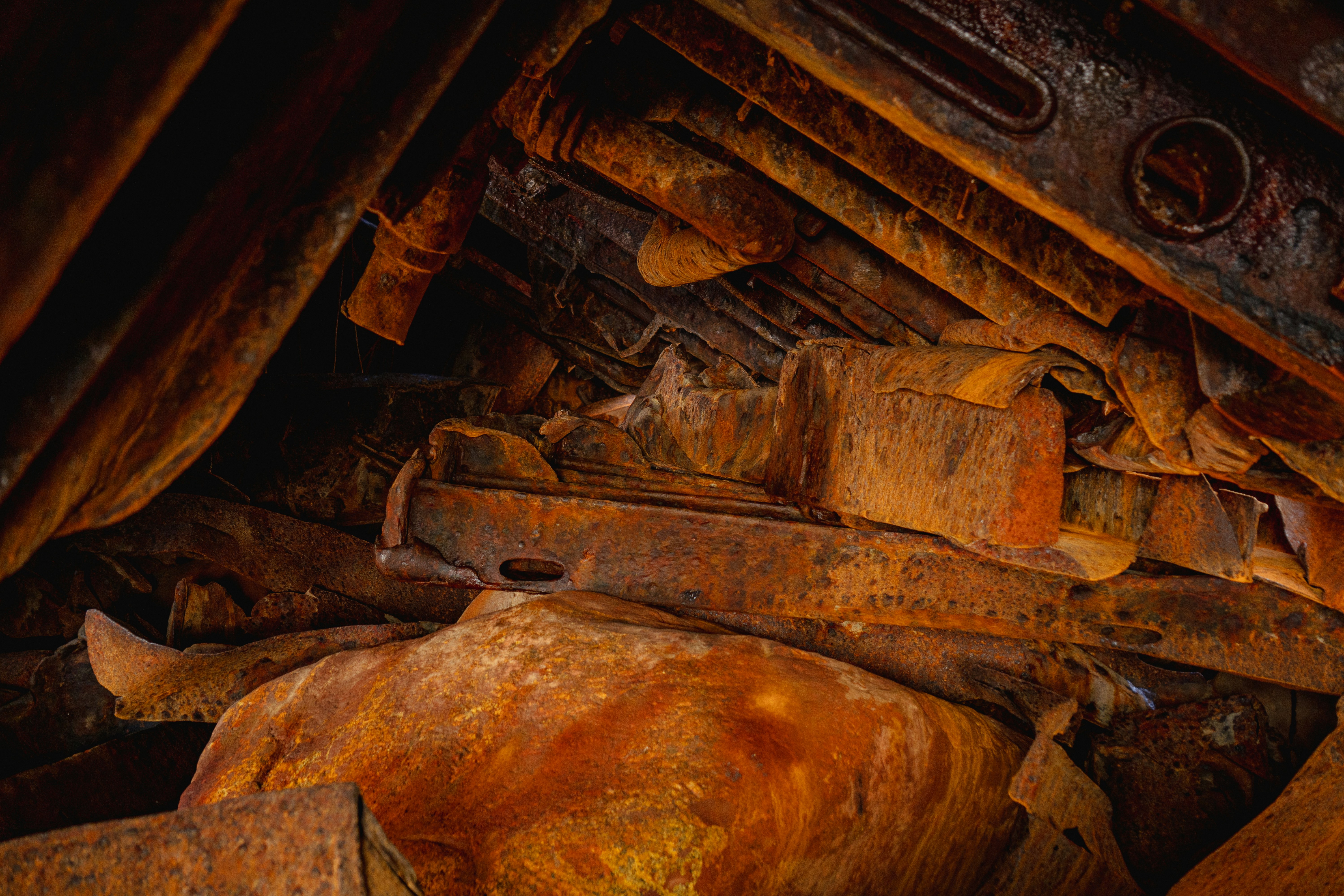 An old rusted bed in a room photo – Free Corrosion Image on Unsplash