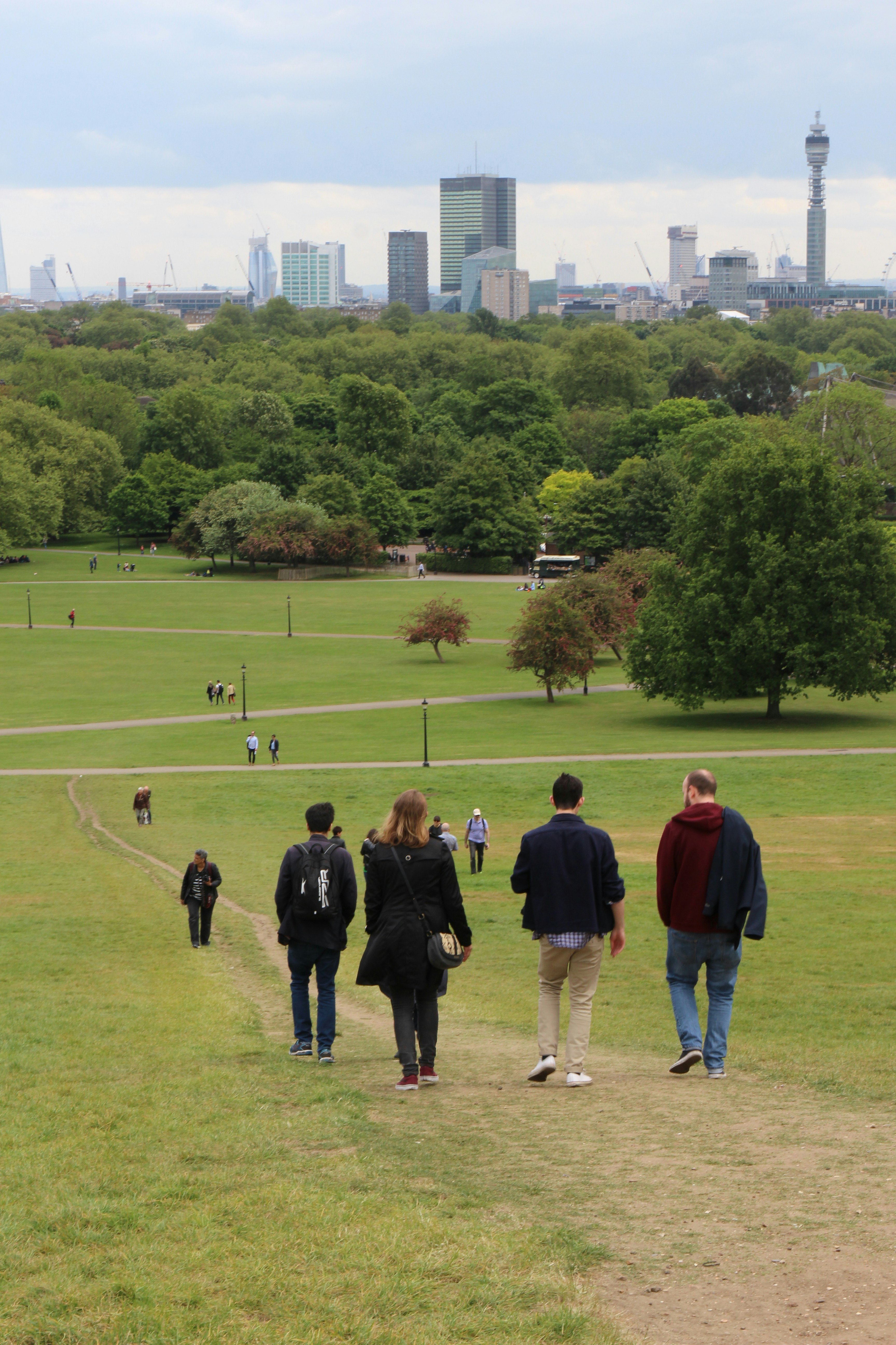 A group of people walking in a park photo – Free Park Image on Unsplash