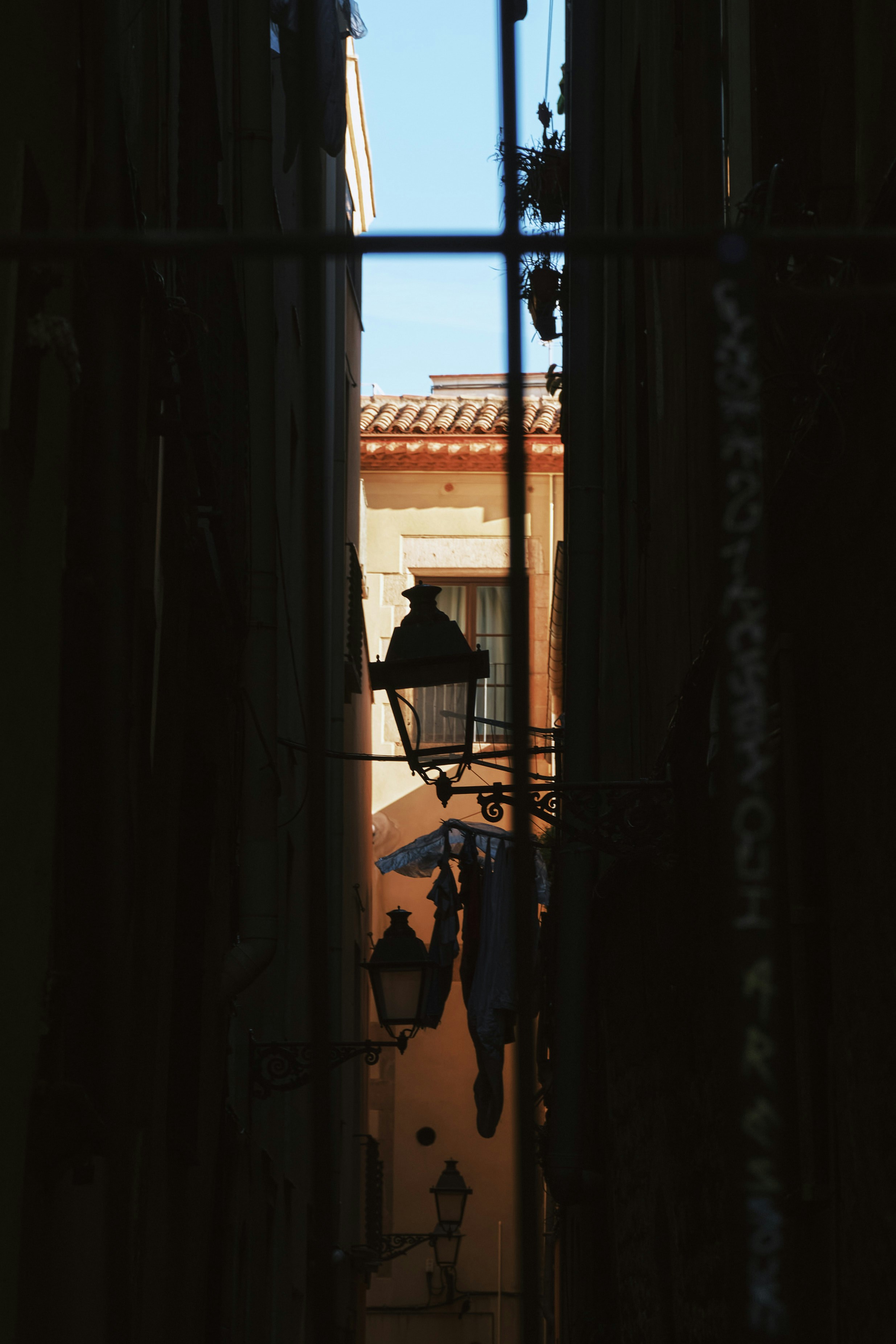 A narrow alley way with clothes hanging on a clothes line photo – Free ...