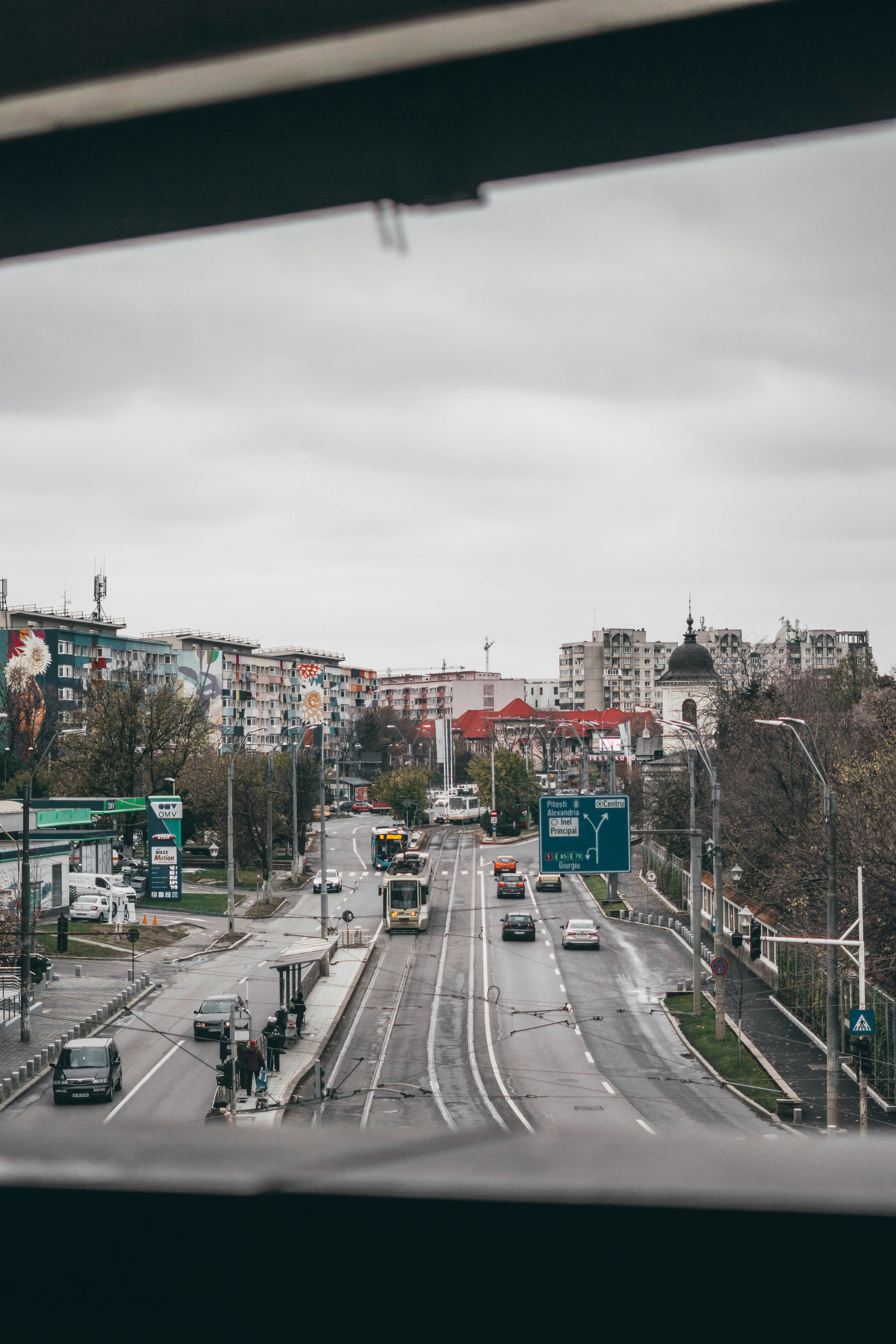 A view of a city street from a bus window photo – Free City Image on ...
