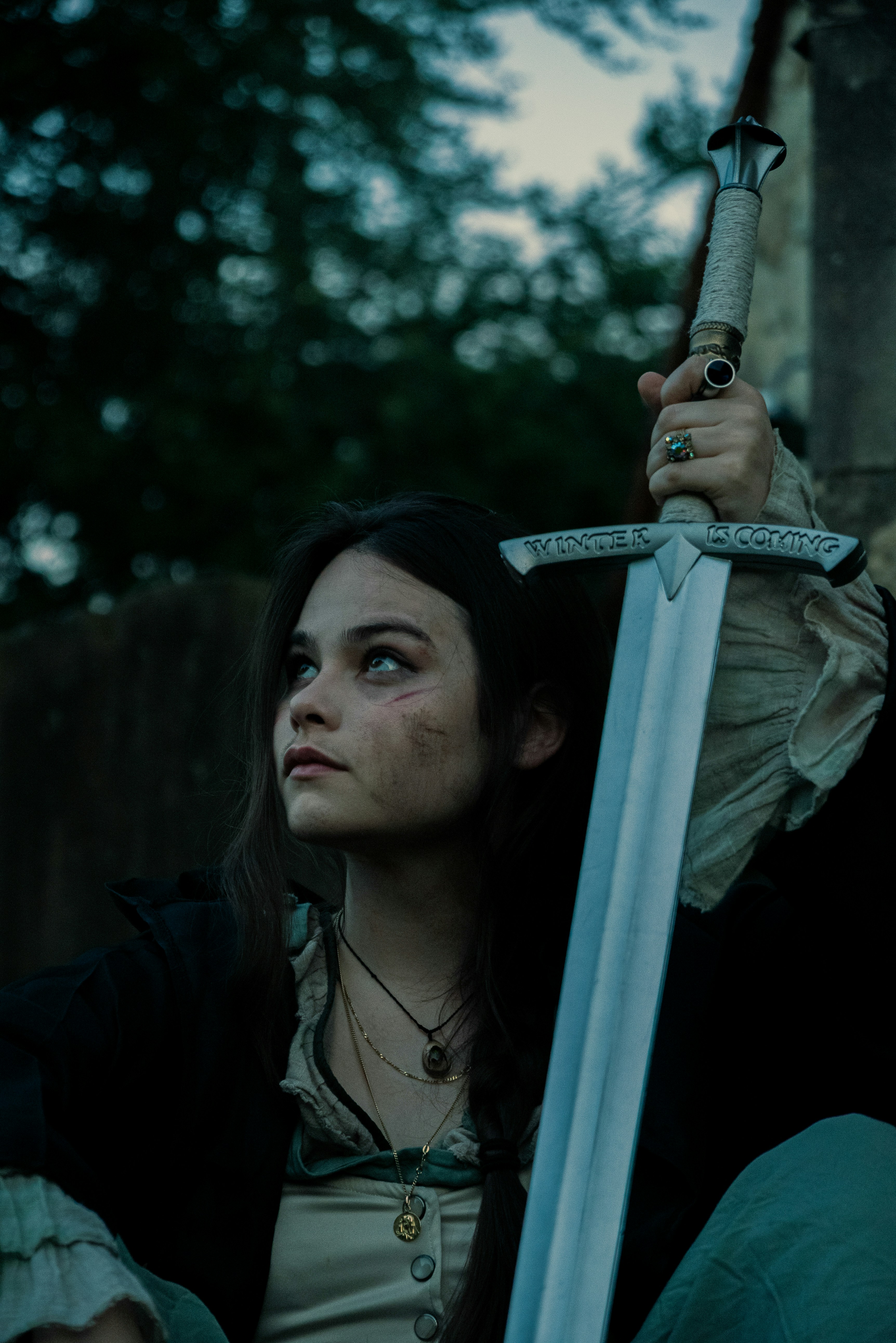 A woman holding a sword in her hand photo – Free Sword Image on Unsplash