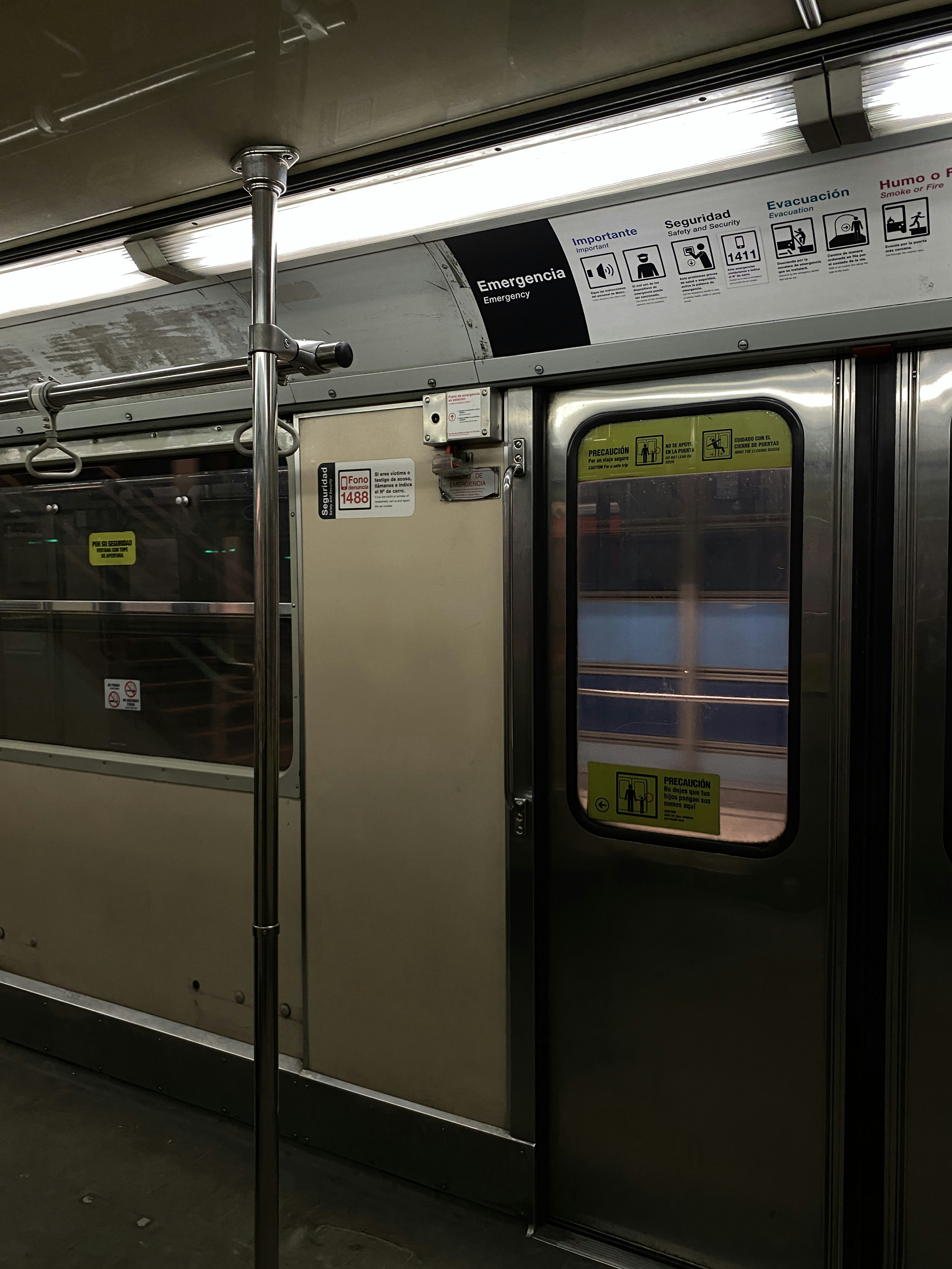 Between Doors and Neon: An Empty Subway Car at Rest