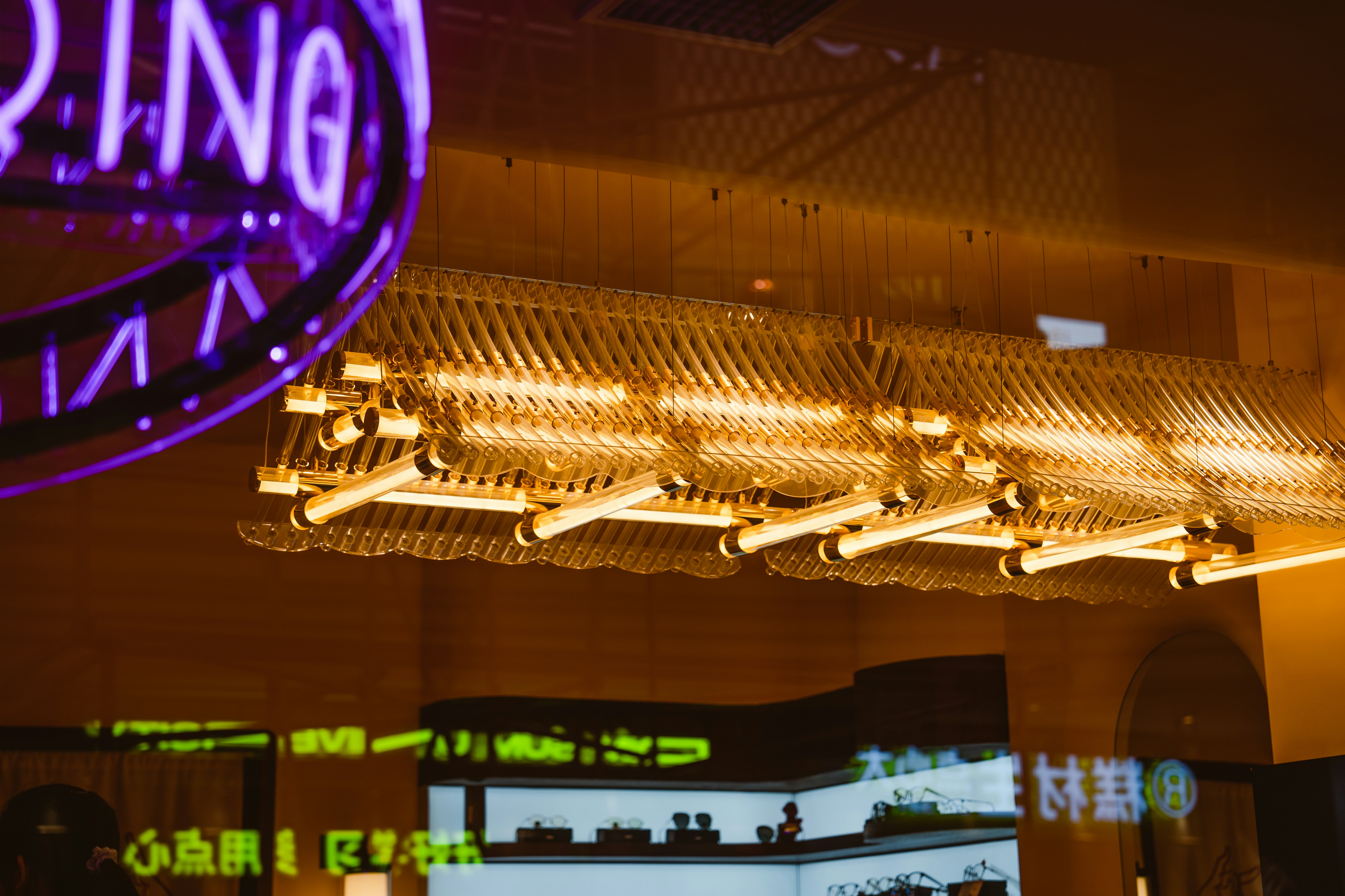 a sign hanging from the ceiling of a building
