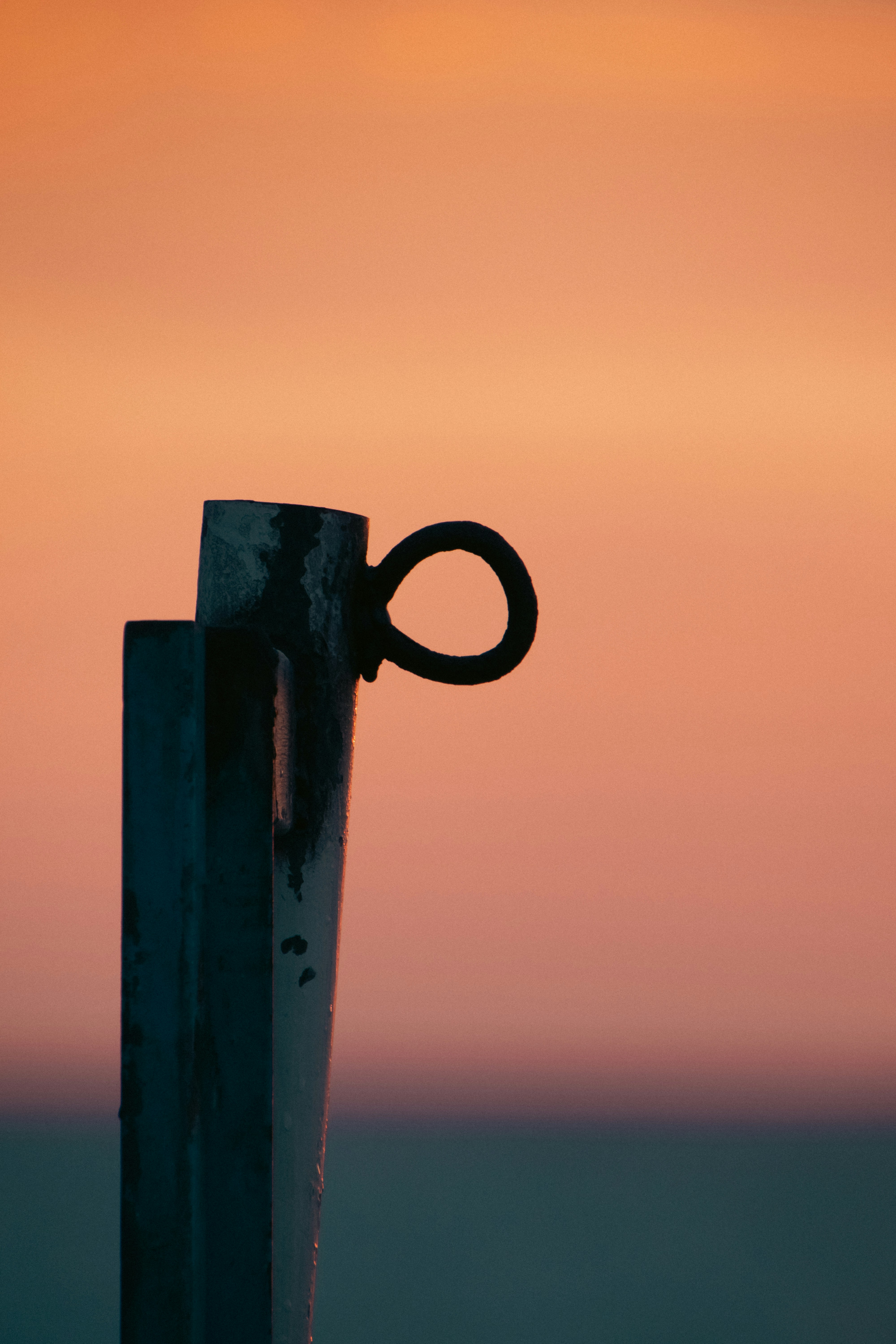 Dusk Ring on Rusted Posts: A Minimal Silhouette