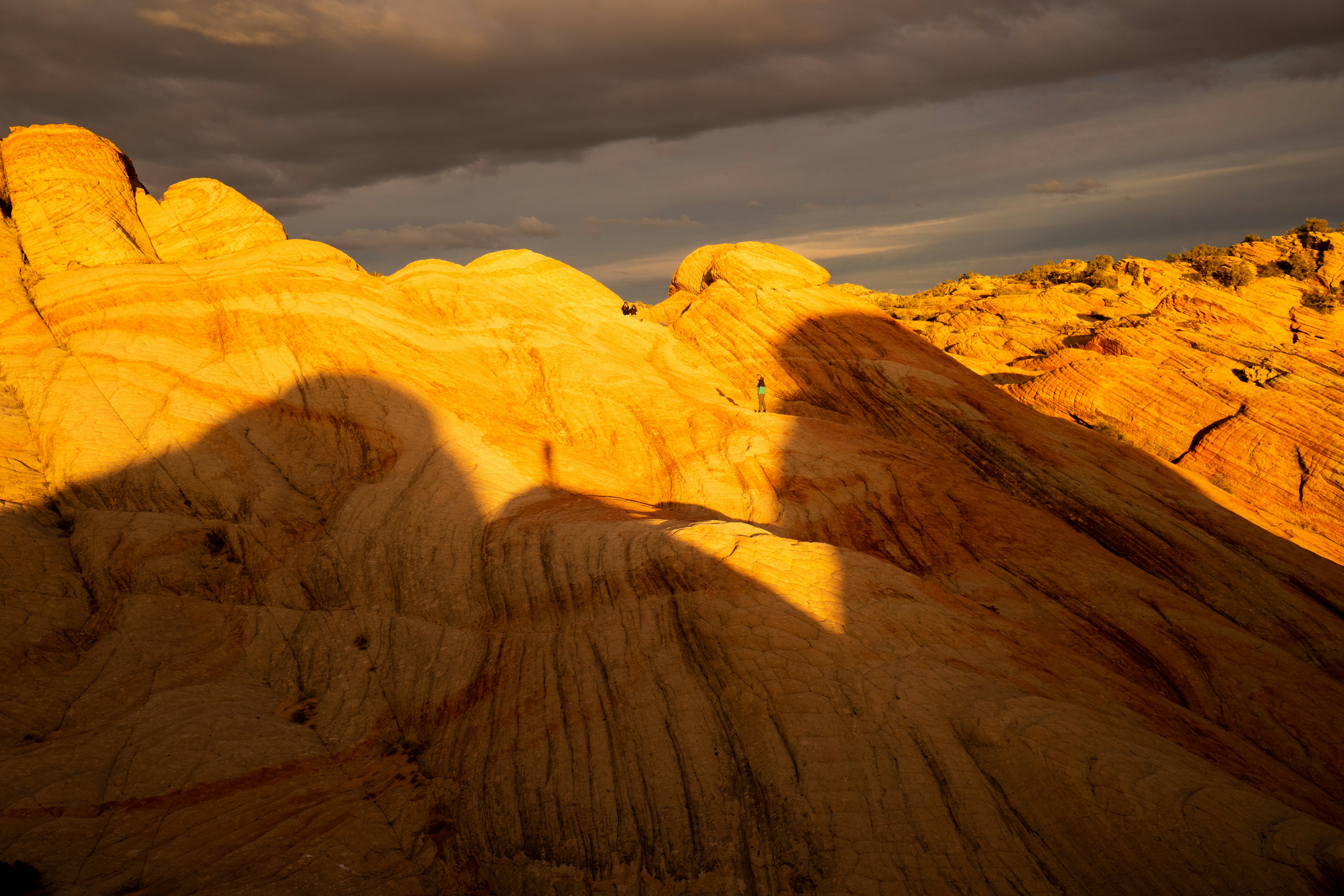 The shadow of two people on a rock formation photo – Free Scenery Image ...