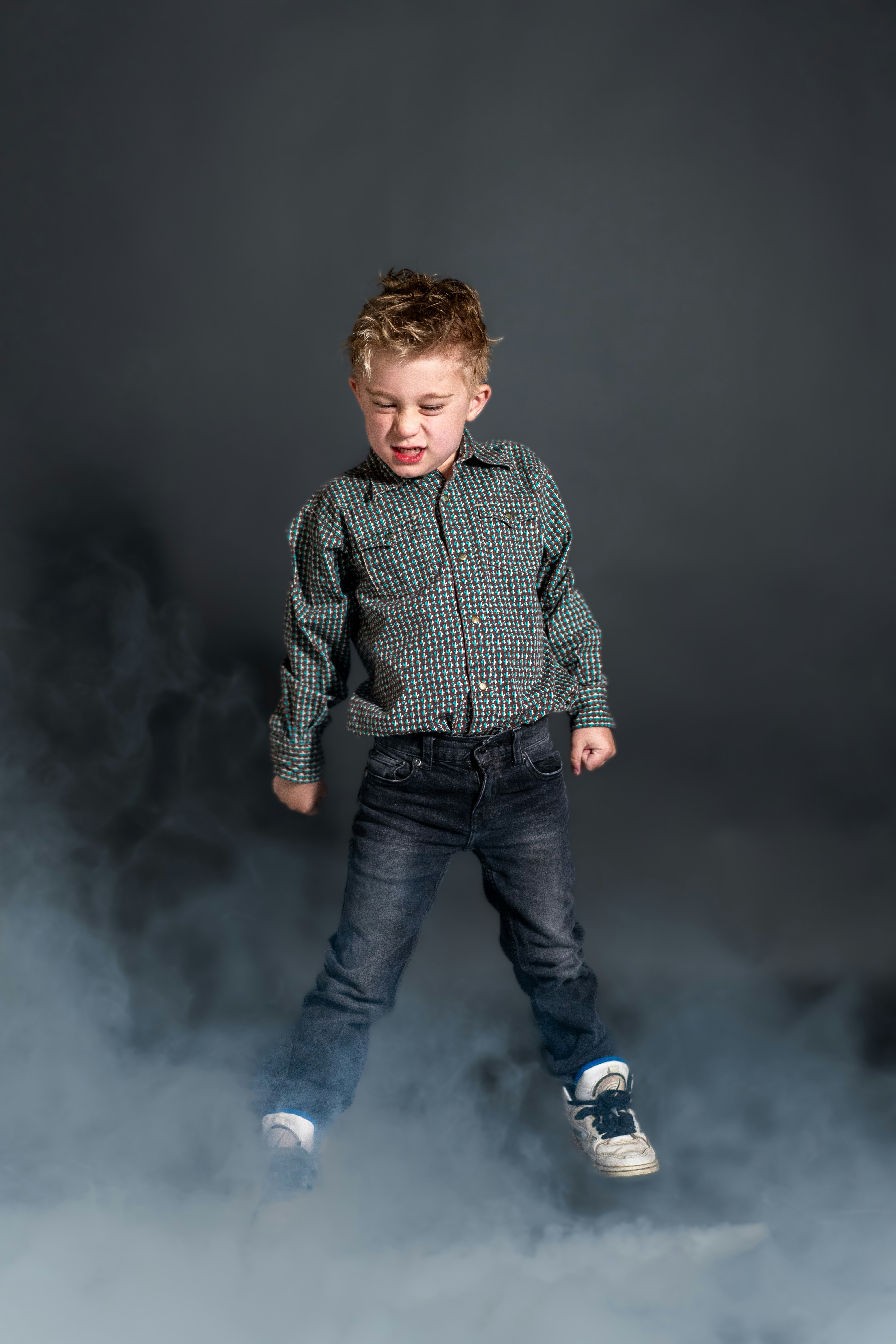 Tiny Daredevil Steps Through Smoke in a Studio Portrait