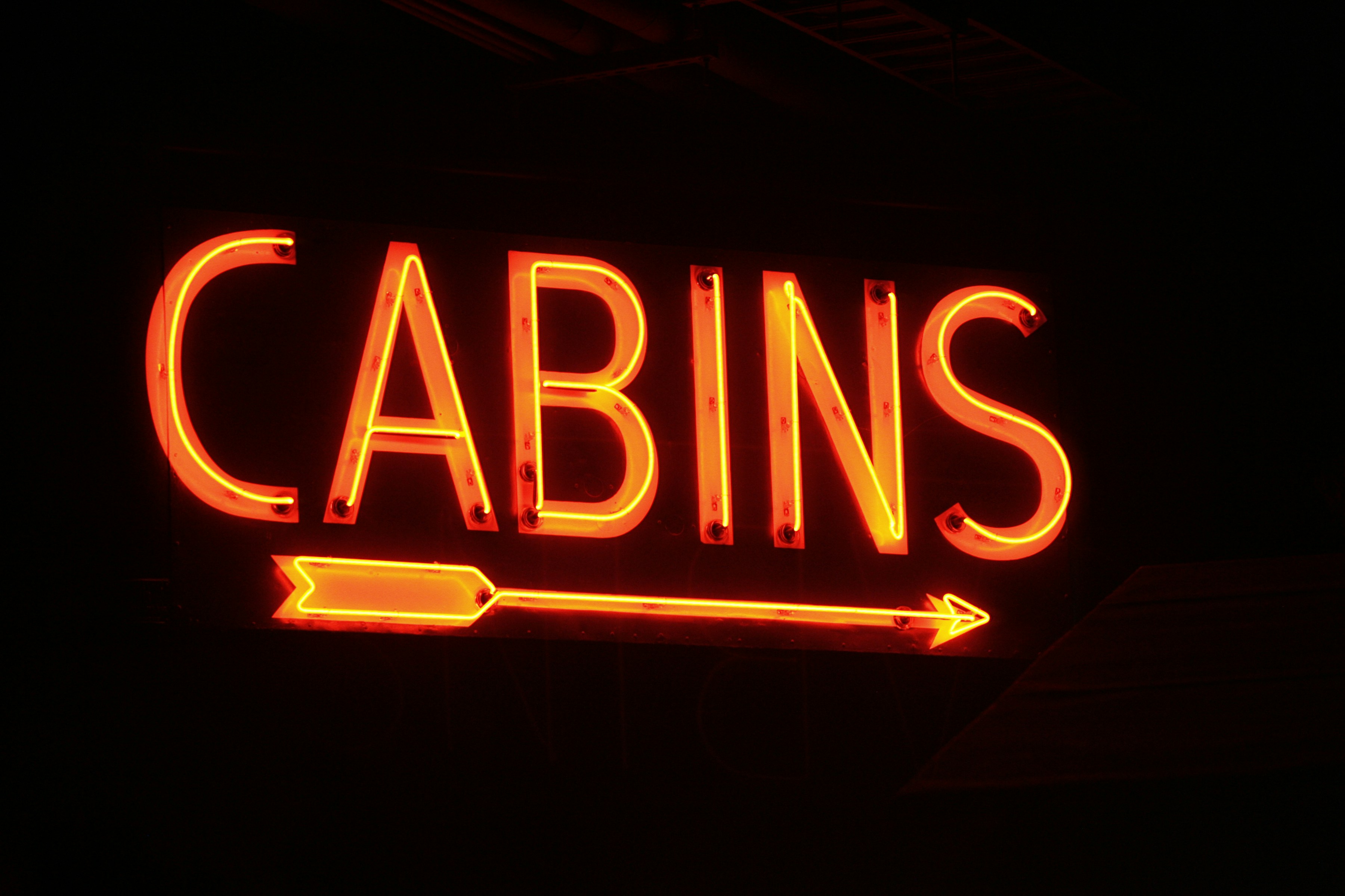 Neon Cabin Arrow at Midnight
