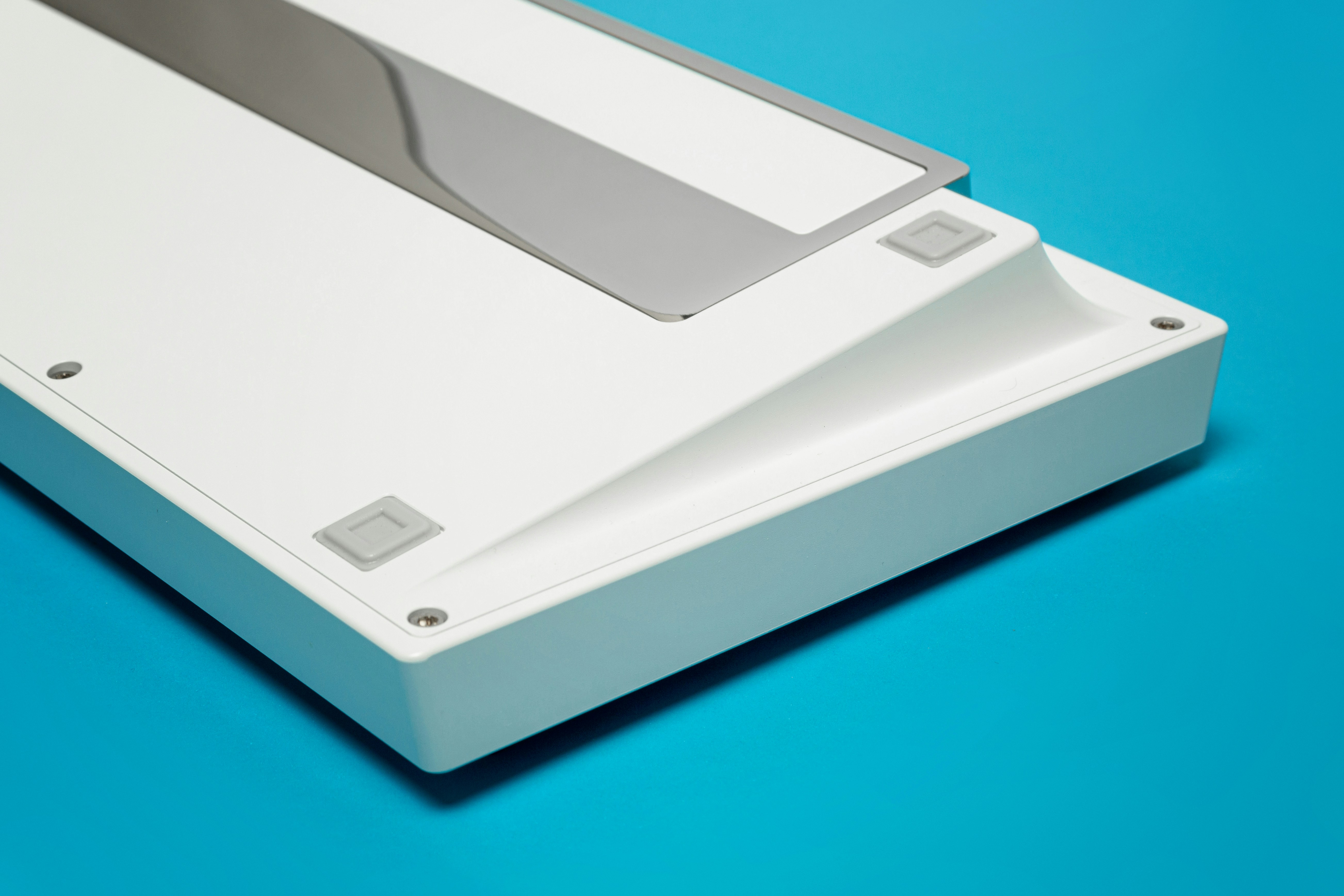 A close up of an electronic device on a blue surface photo – Free ...